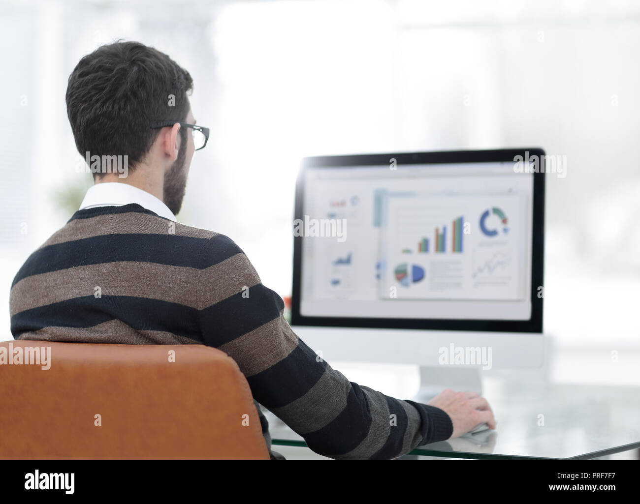Businessman analyzing graphs hi-res stock photography and images - Alamy