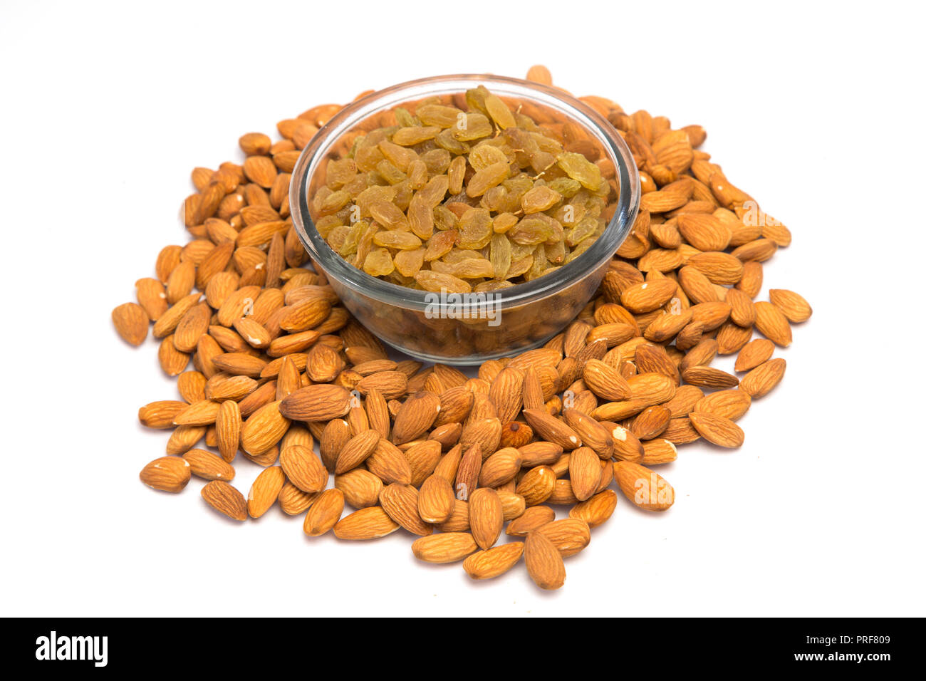 Almonds and raisins isolated on white background Stock Photo - Alamy