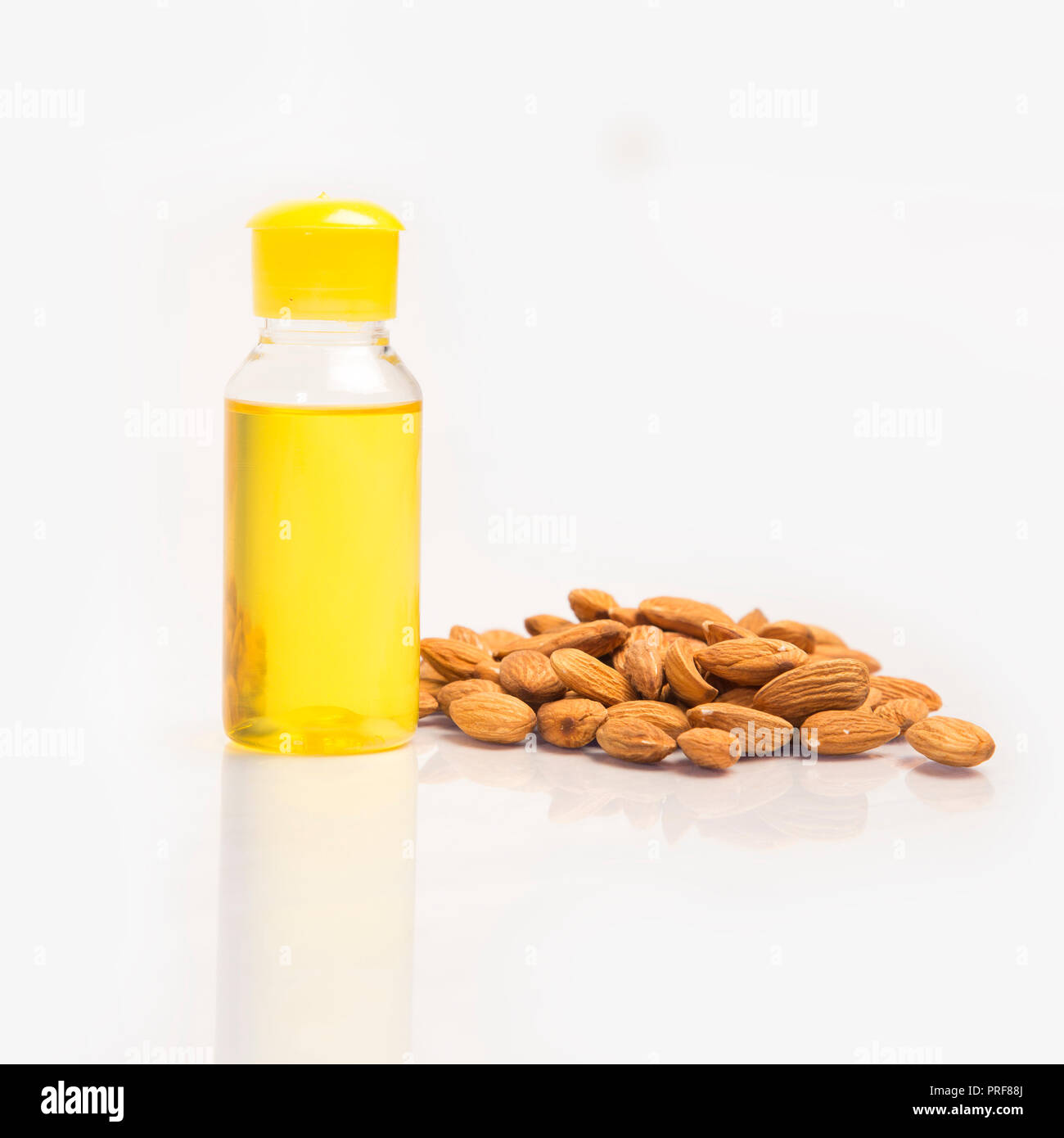 Almond oil bottle/roghan with almond on white background Stock Photo ...