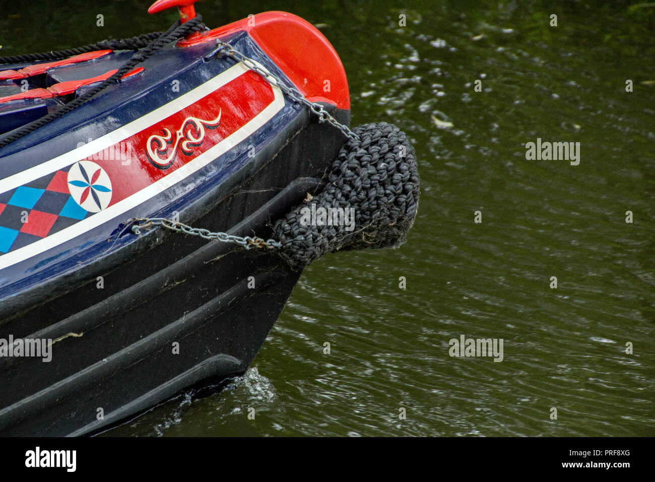 A canal boat and bow wave heading south on the River Stort part of the ...