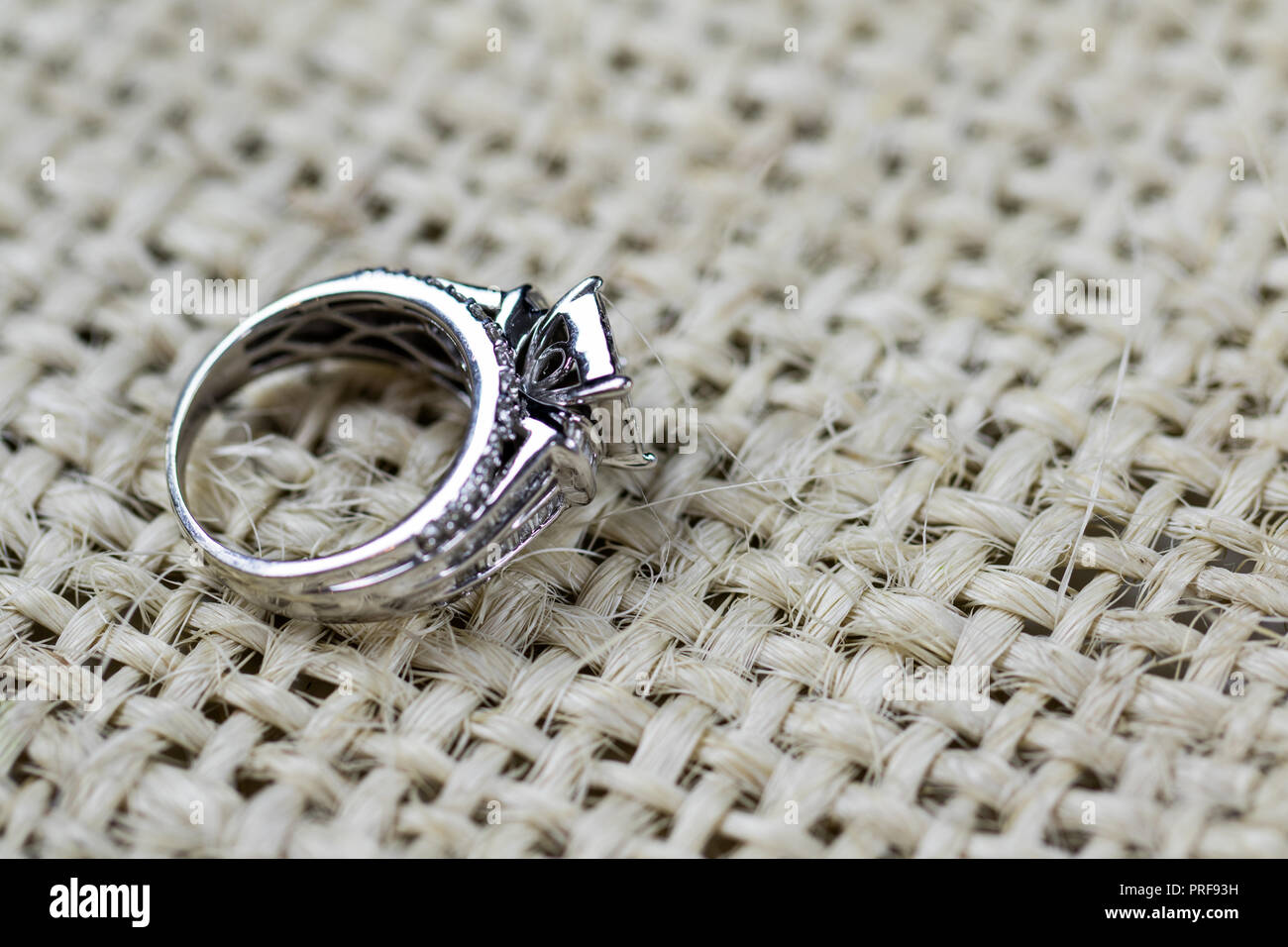 A diamond engagement ring in a box with glint/reflection. Shimmering ...