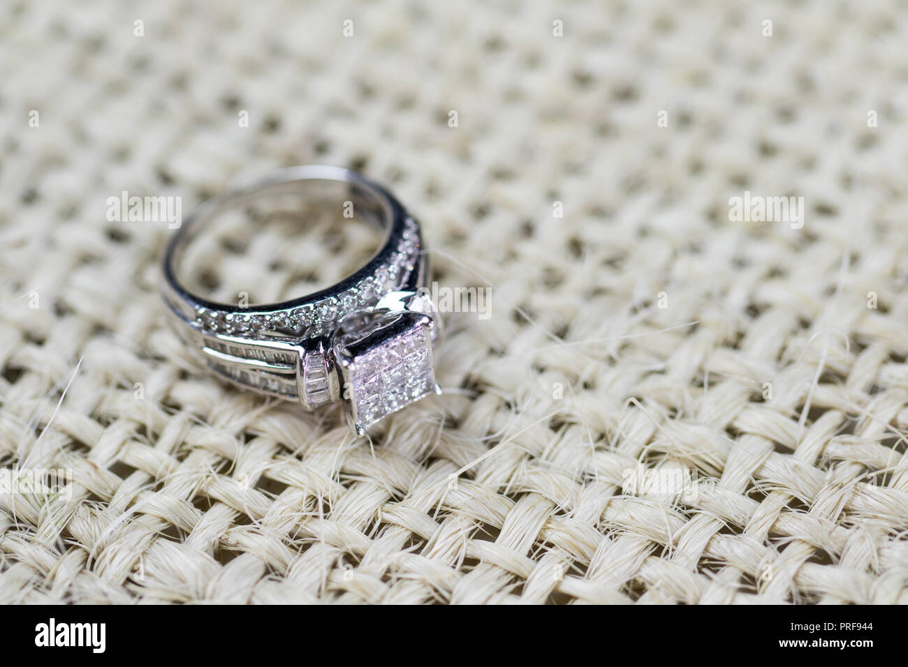 A diamond engagement ring in a box with glint/reflection. Shimmering ...