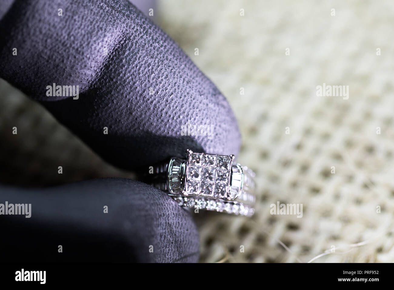 A diamond engagement ring in a box with glint/reflection. Shimmering ...
