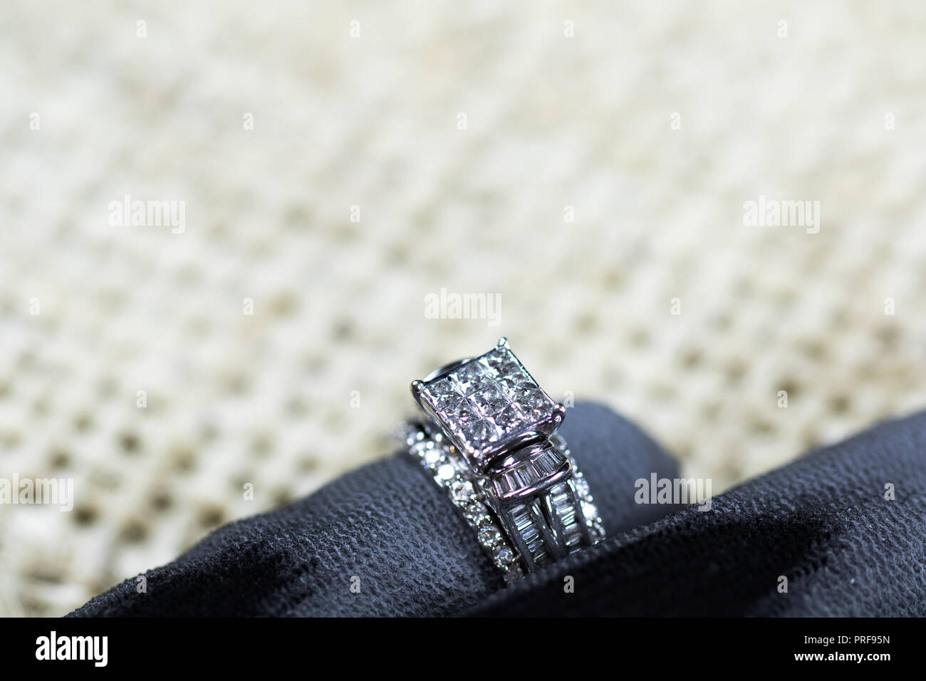 A diamond engagement ring in a box with glint/reflection. Shimmering ...