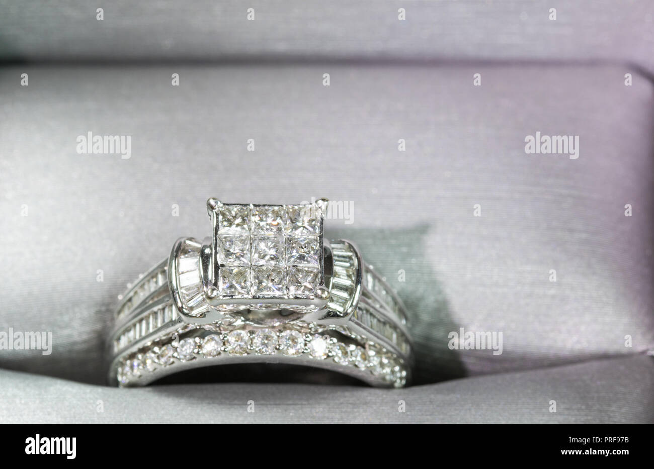 A diamond engagement ring in a box with glint/reflection. Shimmering ...