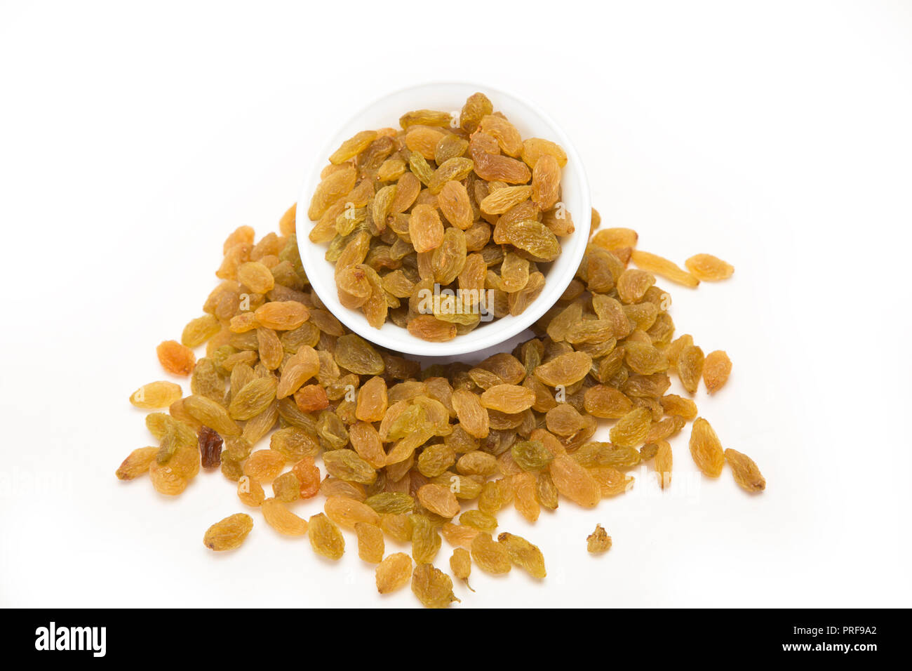 Golden raisins in bowl. Isolated on white background Stock Photo - Alamy