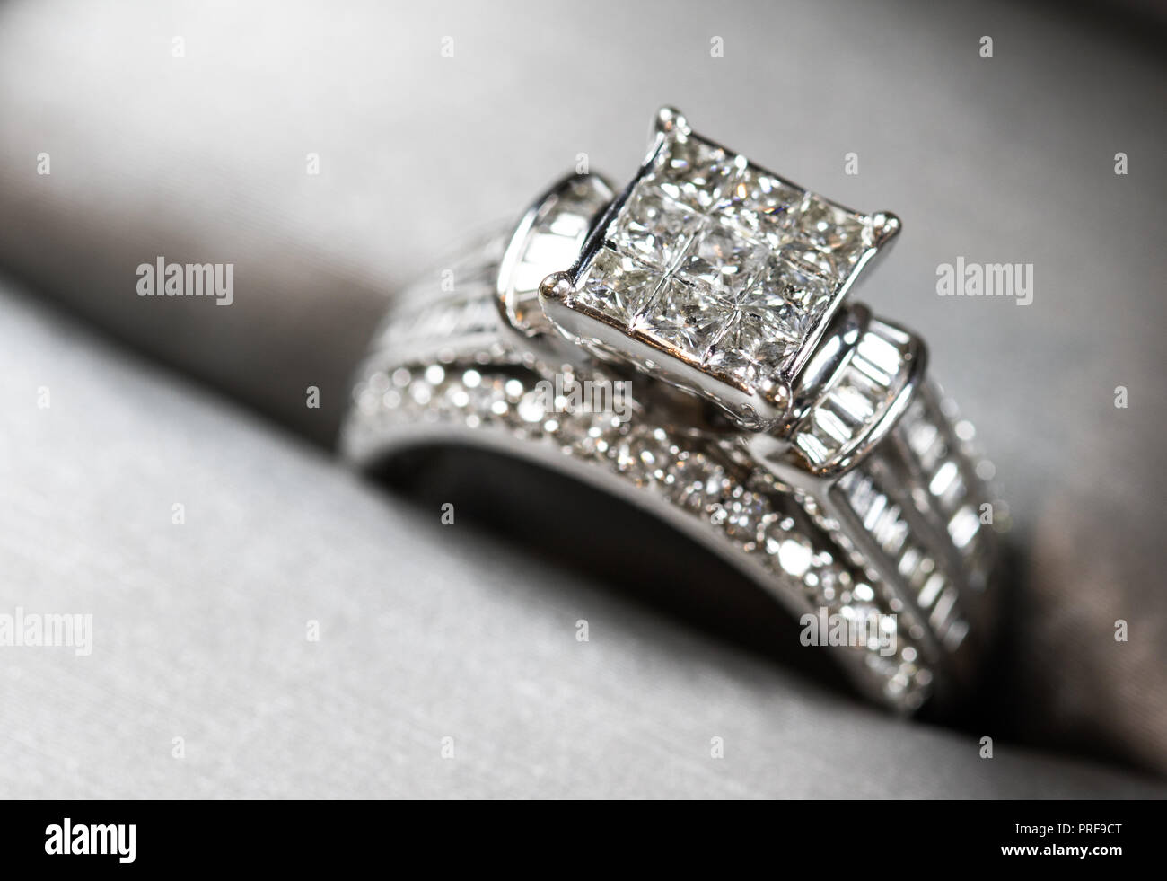 A diamond engagement ring in a box with glint/reflection. Shimmering ...