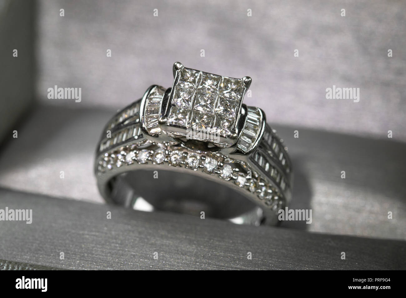 A diamond engagement ring in a box with glint/reflection. Shimmering ...