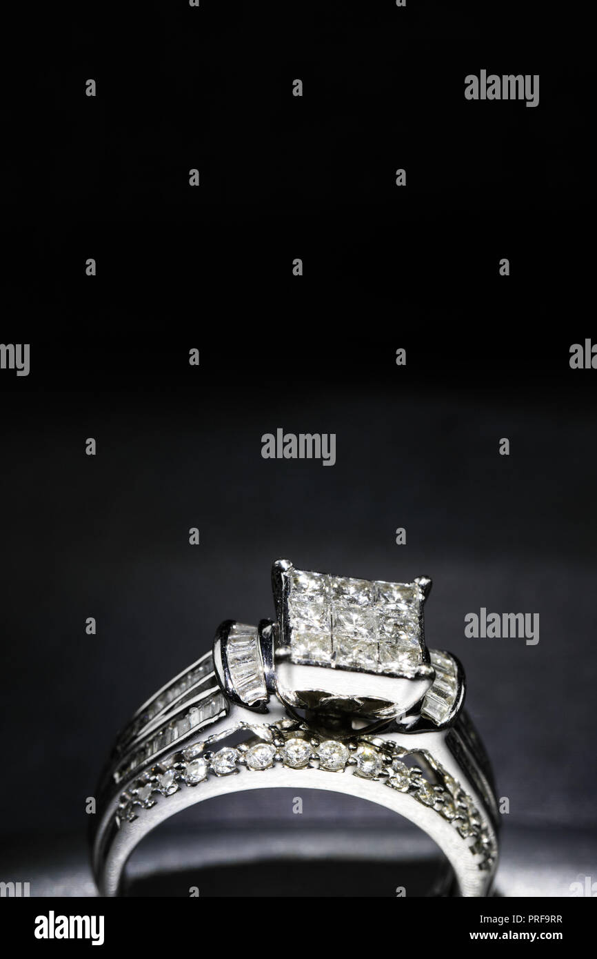 A diamond engagement ring in a box with glint/reflection. Shimmering ...