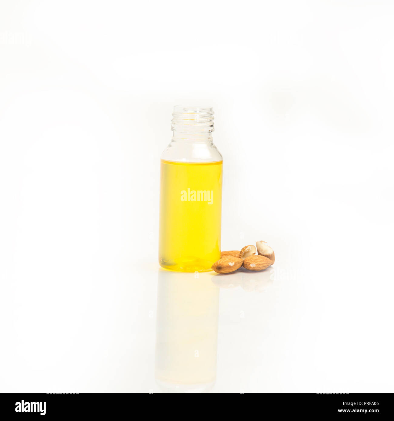 Almond oil/roghan, almond nut heap isolated on white background Stock ...