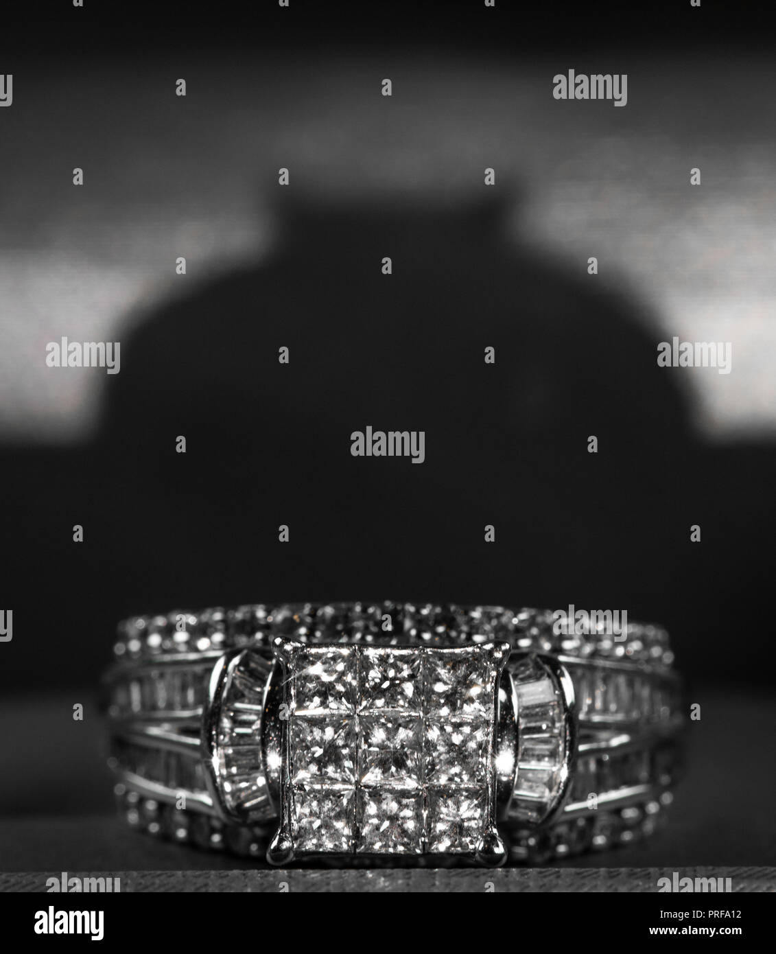 A diamond engagement ring in a box with glint/reflection. Shimmering ...