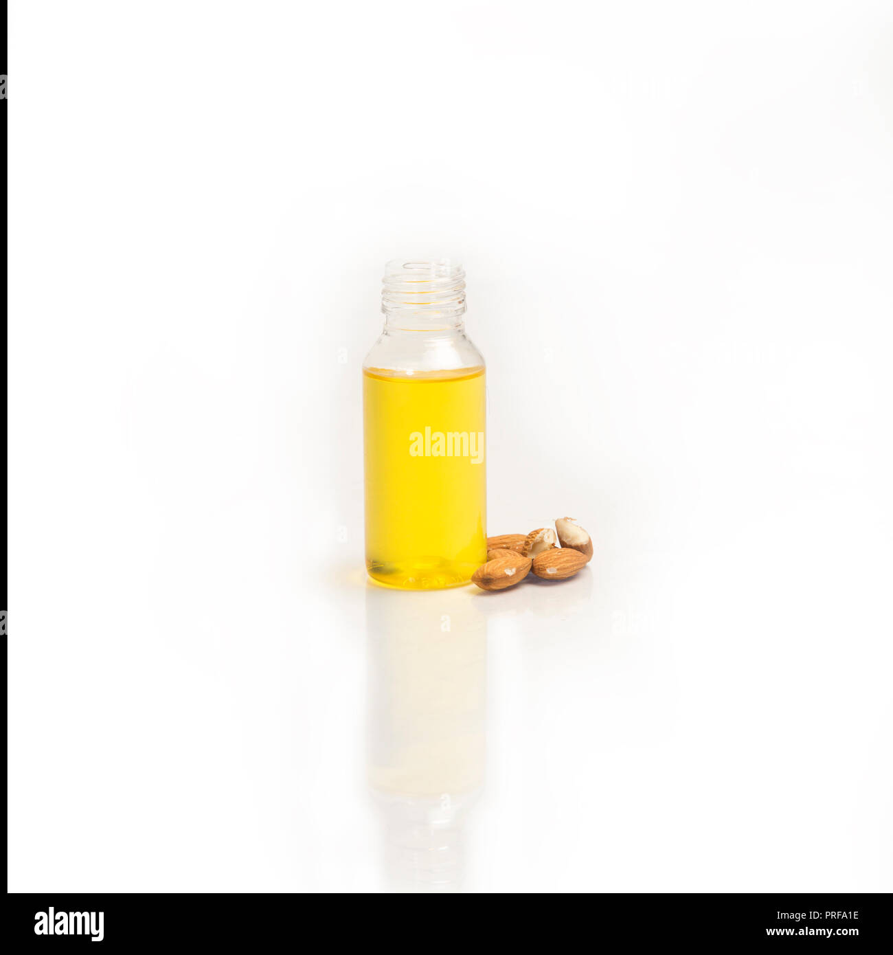 Almond oil/ roghan, almond nut heap isolated on white background Stock ...