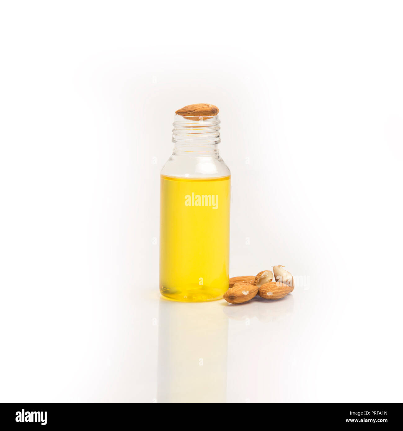 Almond oil/roghan, almond nut heap isolated on white background Stock ...