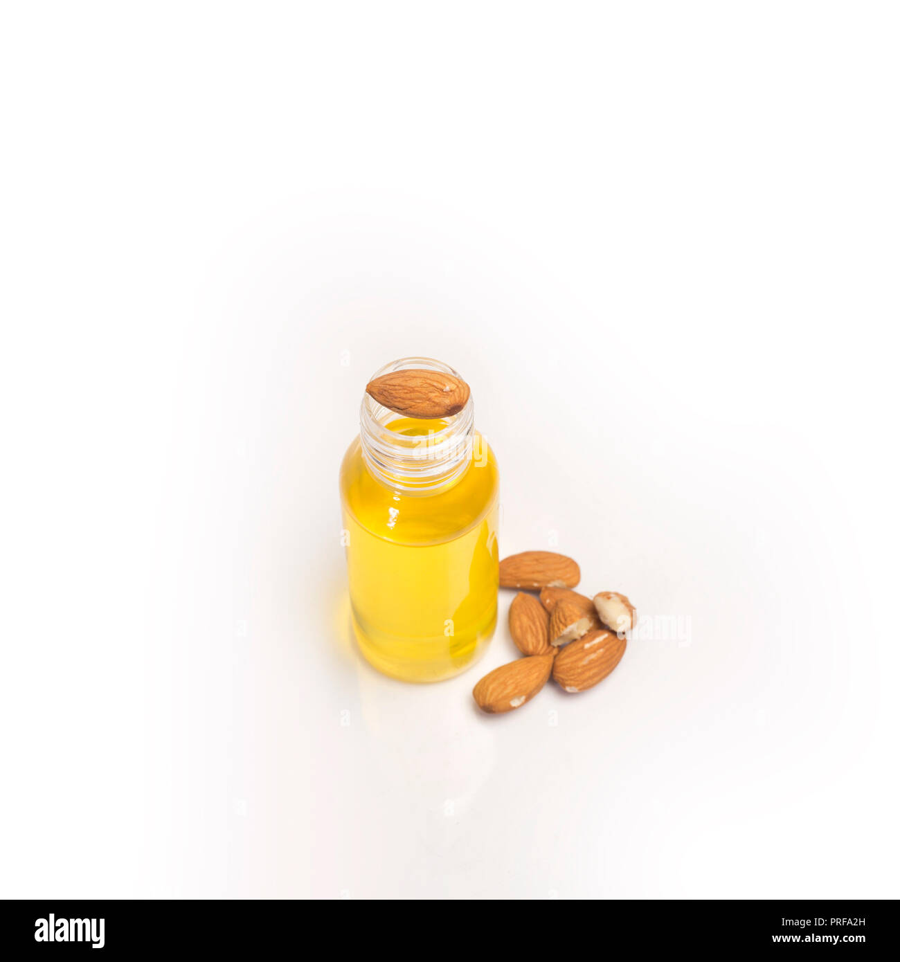 Almond oil/roghan, almond nut heap isolated on white background Stock ...
