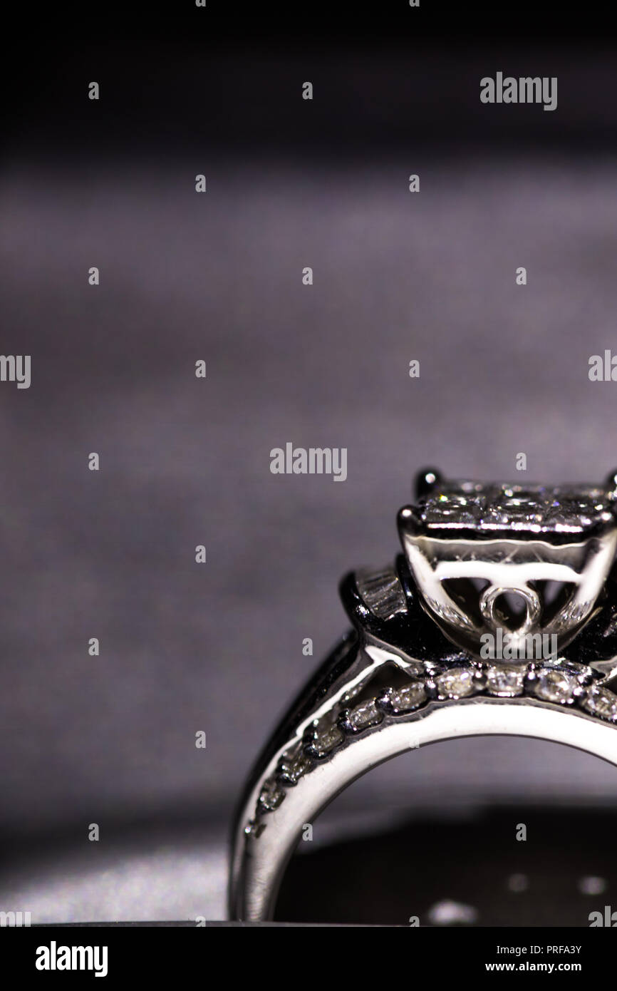 A diamond engagement ring in a box with glint/reflection. Shimmering ...