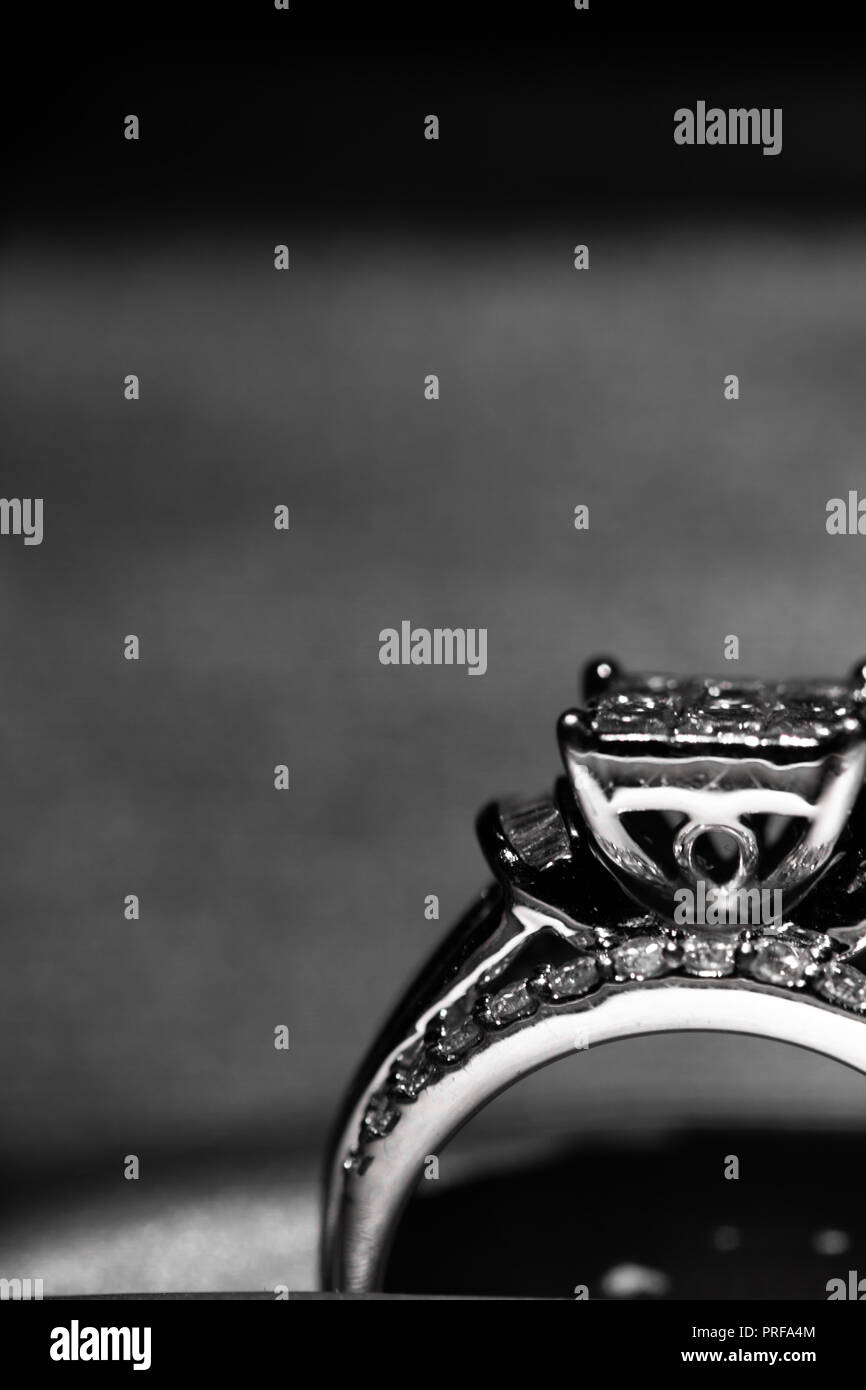 A diamond engagement ring in a box with glint/reflection. Shimmering ...