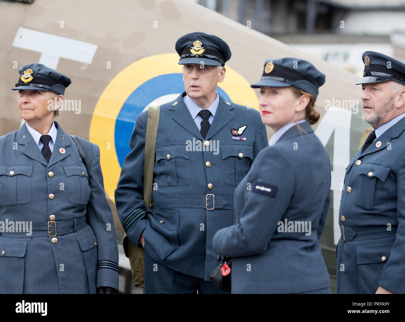 Men and women in 1940’s style RAF uniforms with a Hurricane aircraft at ...