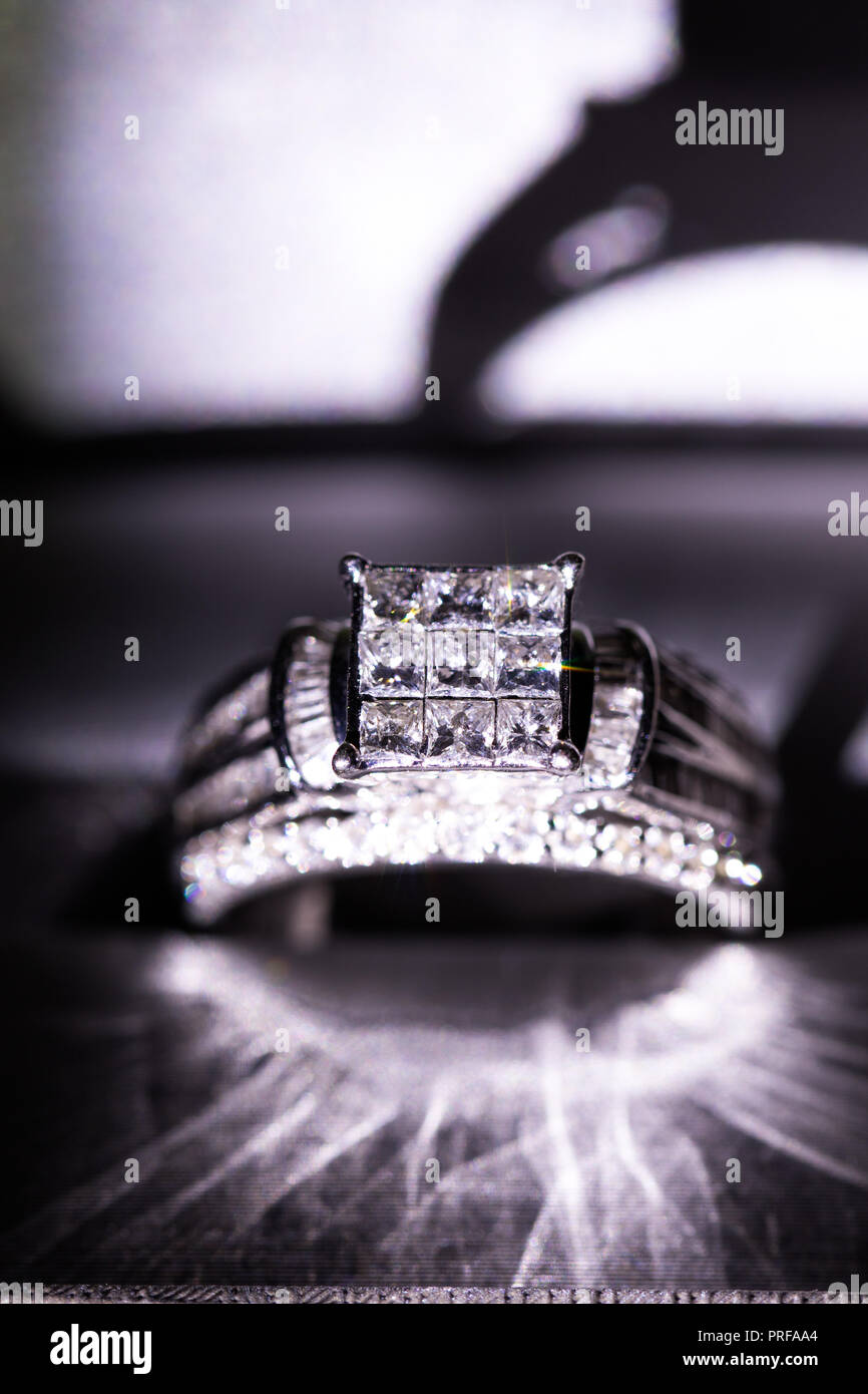 A diamond engagement ring in a box with glint/reflection. Shimmering ...