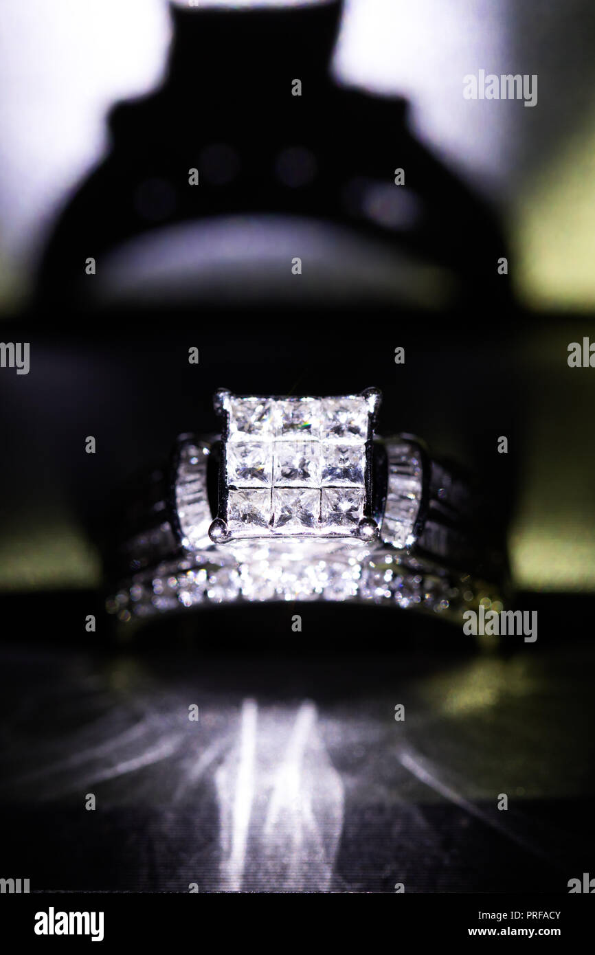 A diamond engagement ring in a box with glint/reflection. Shimmering ...