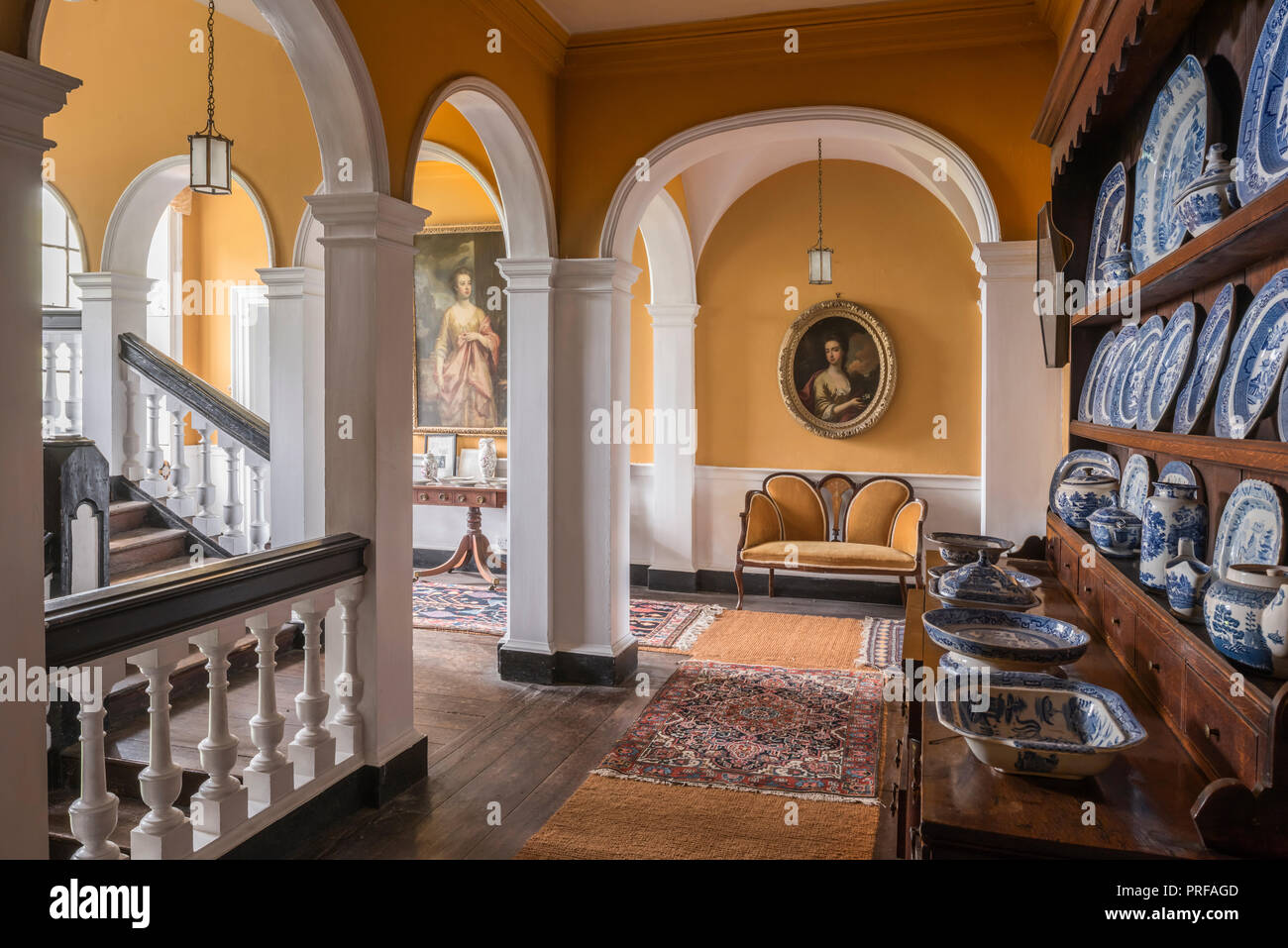 Sheraton style settee with 18th century portrait Stock Photo - Alamy