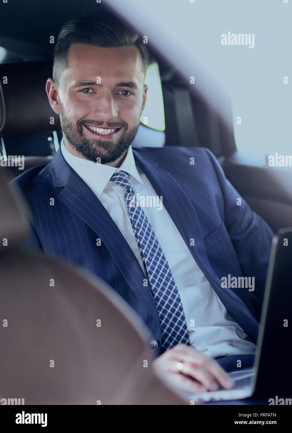 Close-up of a successful businessman sitting in a car Stock Photo - Alamy