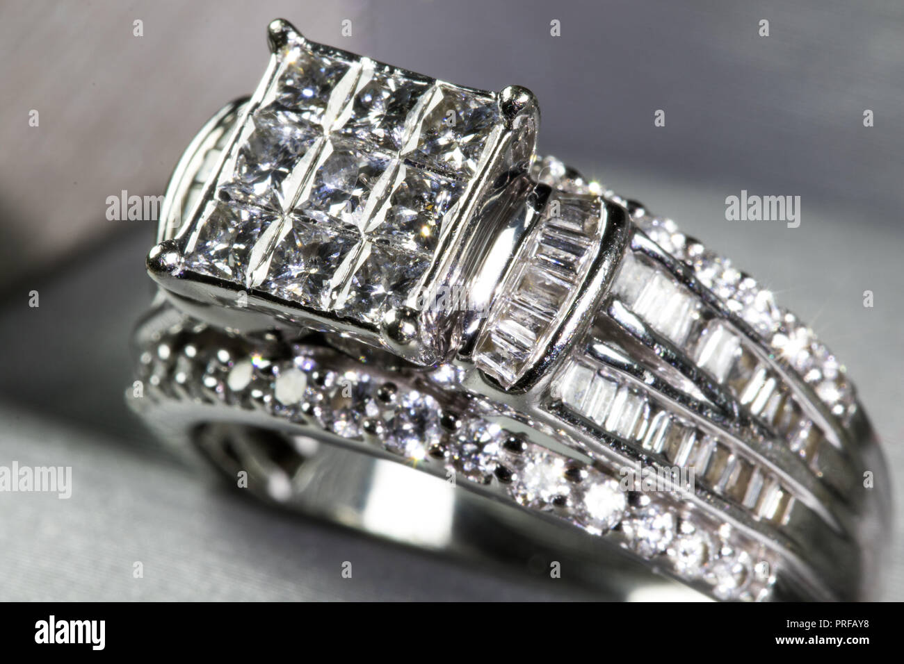 A diamond engagement ring in a box with glint/reflection. Shimmering ...