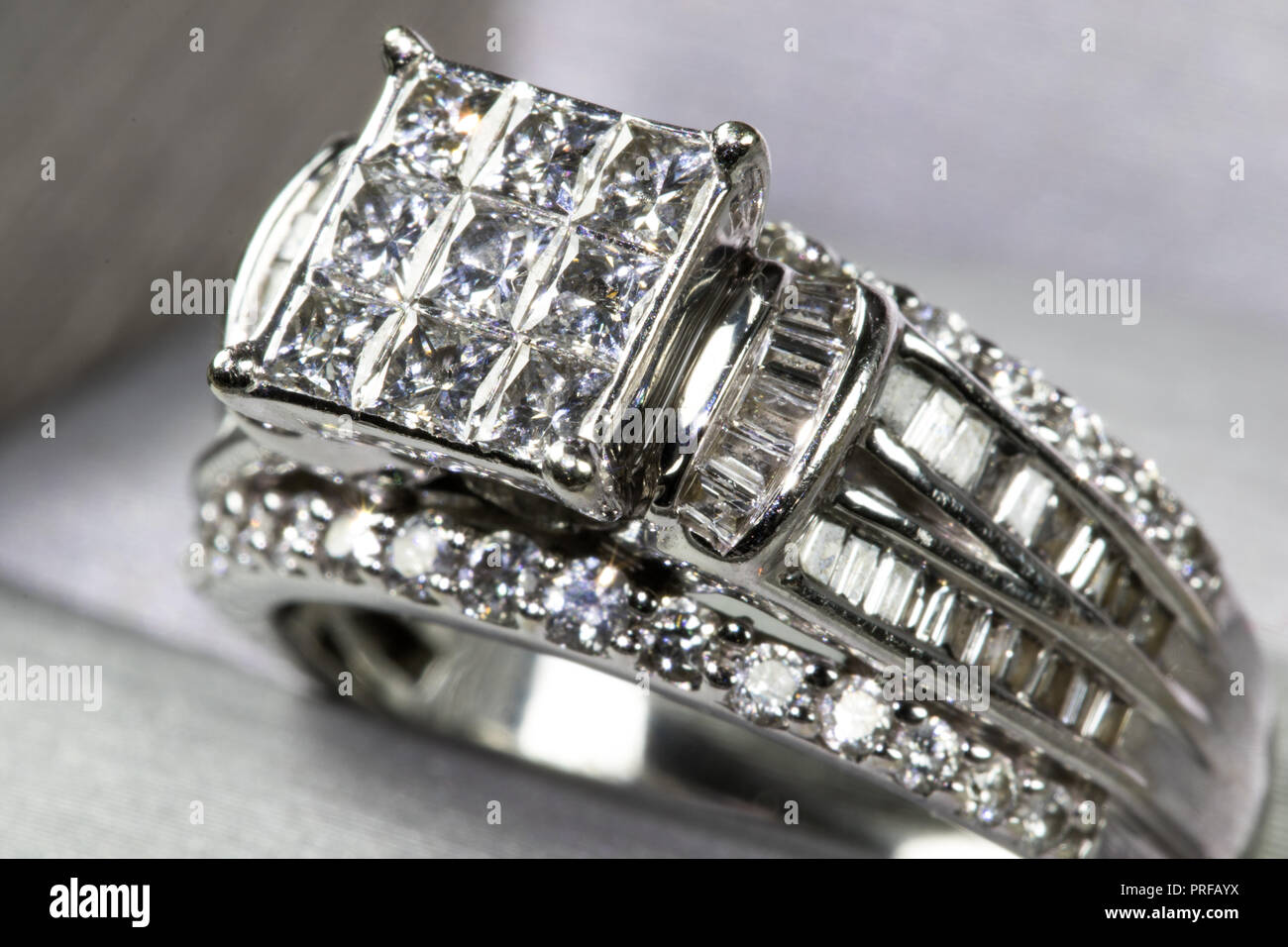 A diamond engagement ring in a box with glint/reflection. Shimmering ...