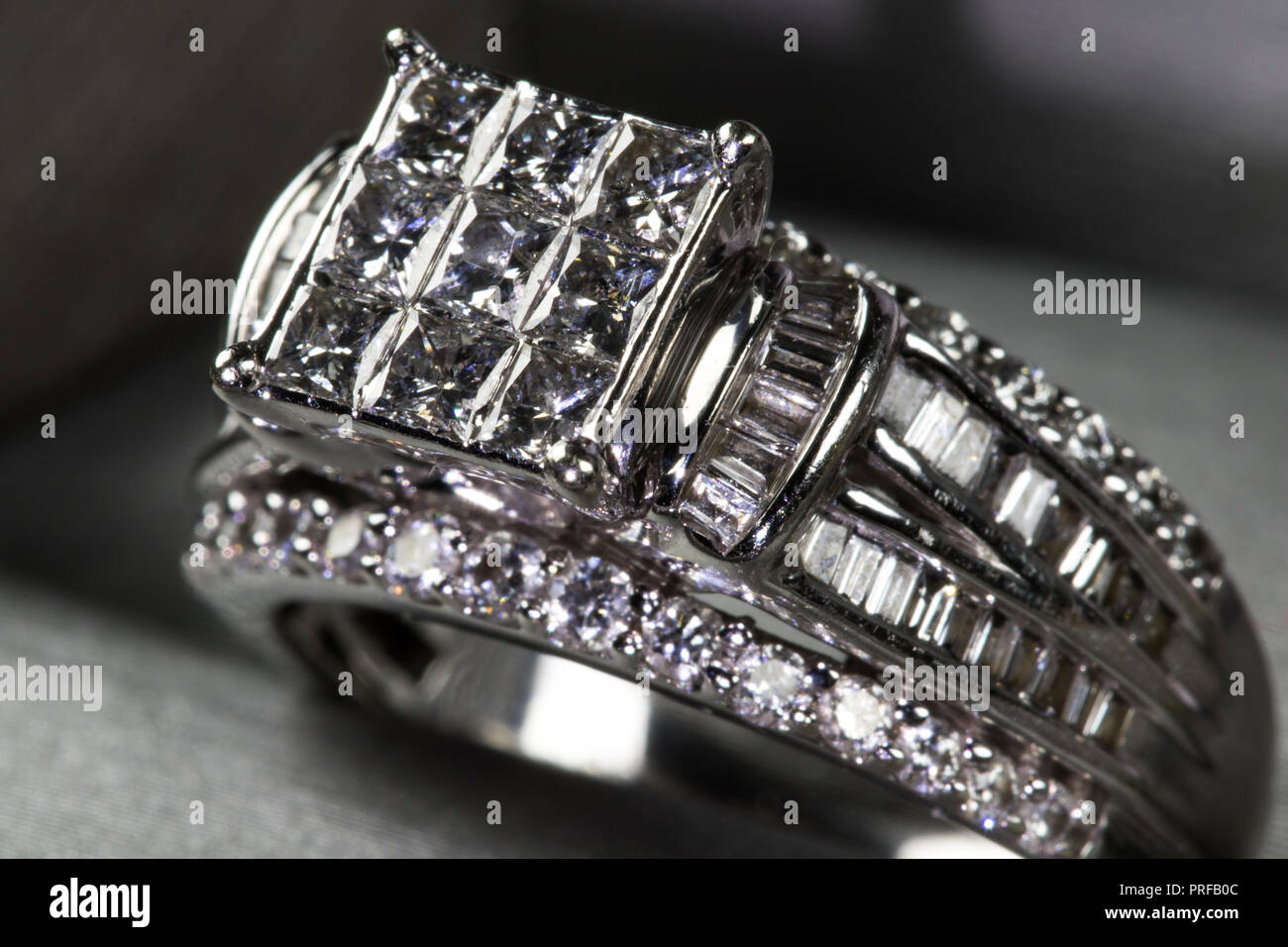 A diamond engagement ring in a box with glint/reflection. Shimmering ...