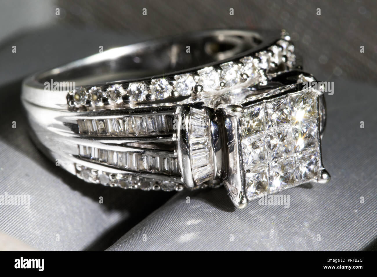 A diamond engagement ring in a box with glint/reflection. Shimmering ...