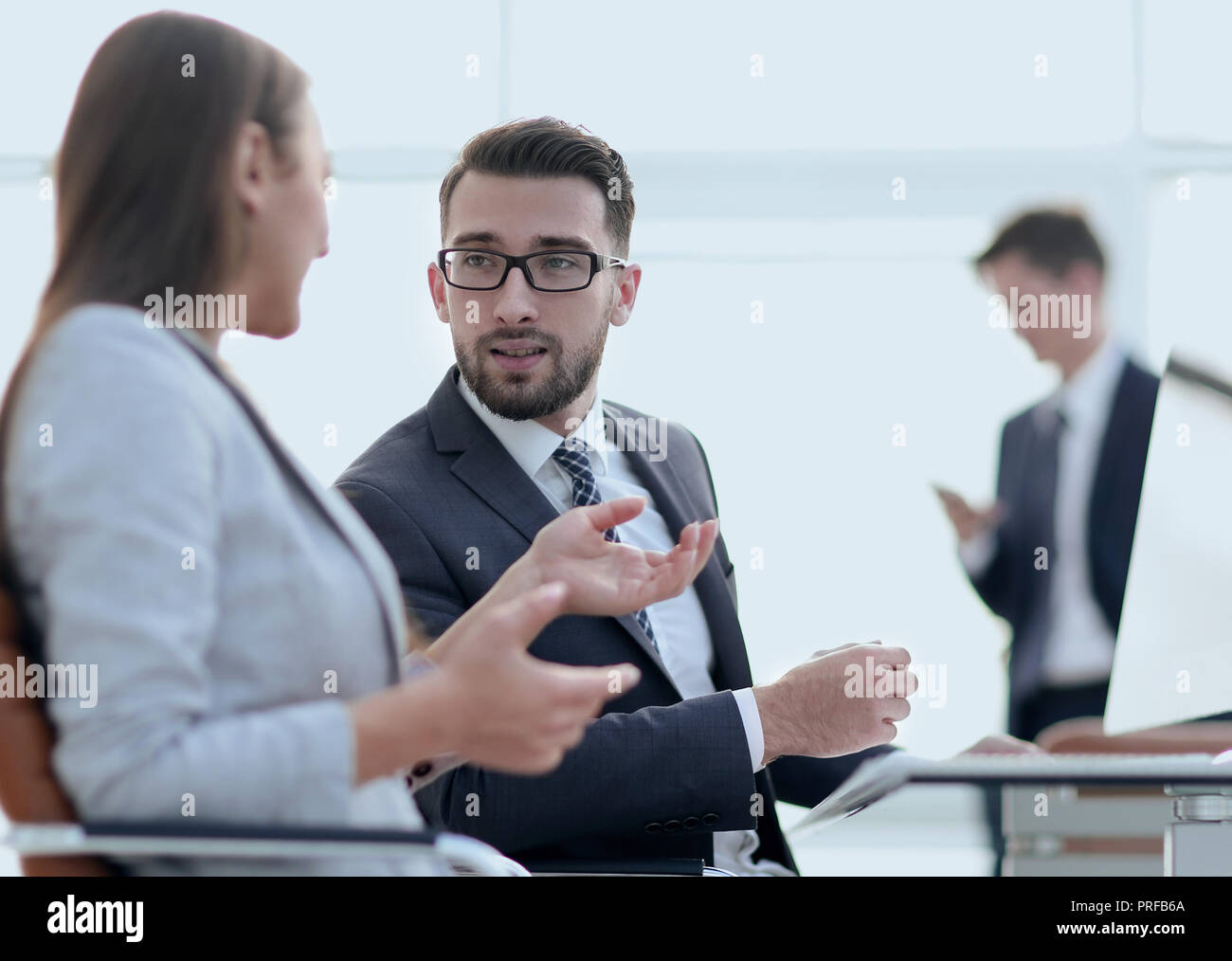 prospective employees are talking at their Desk Stock Photo - Alamy