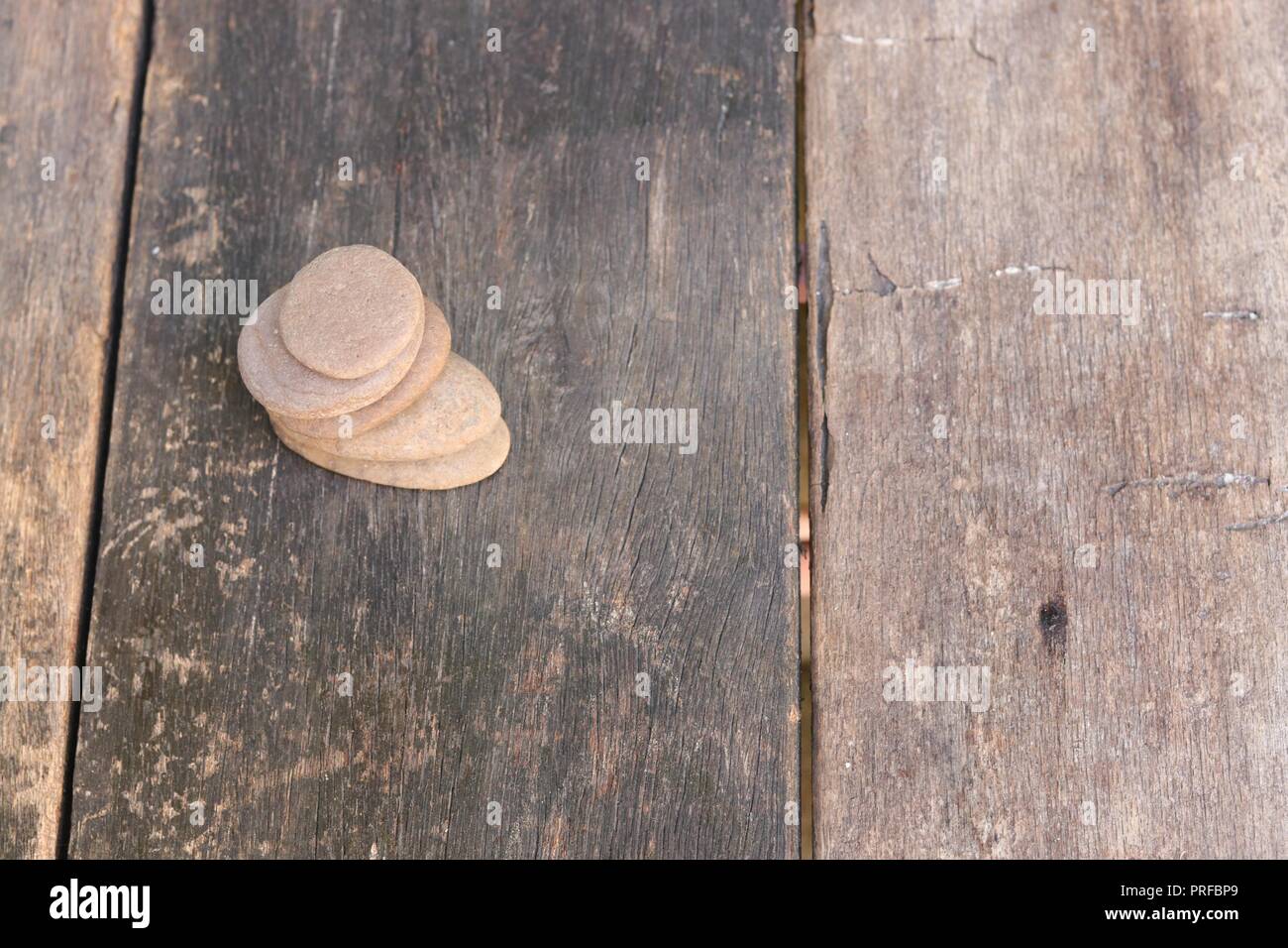 Pyramid stone on the wooden floor background Stock Photo - Alamy