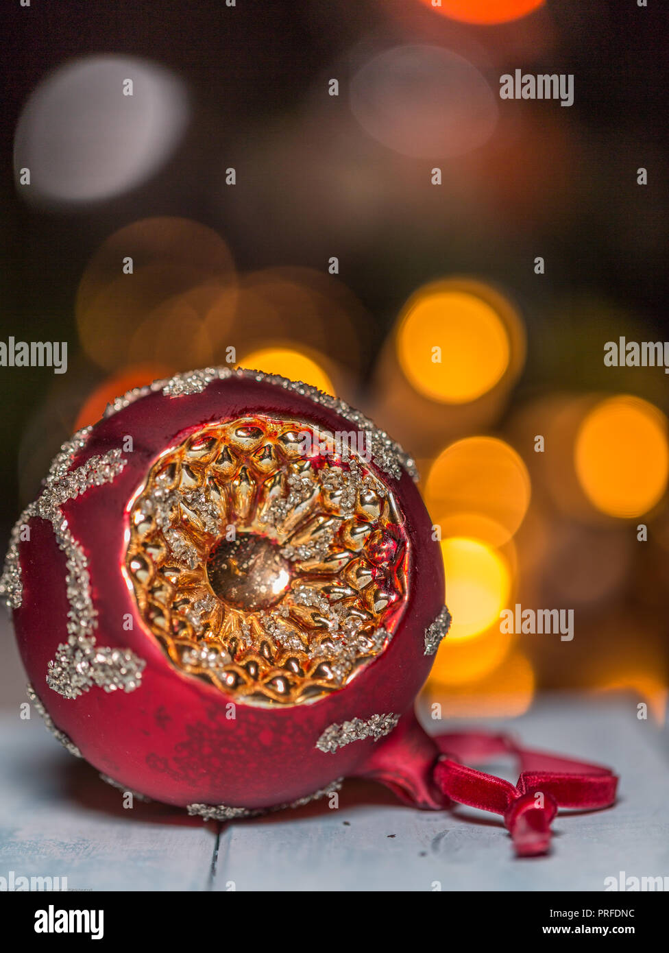 Christmas Bauble on Spruce Tree Branch and lights background Stock ...