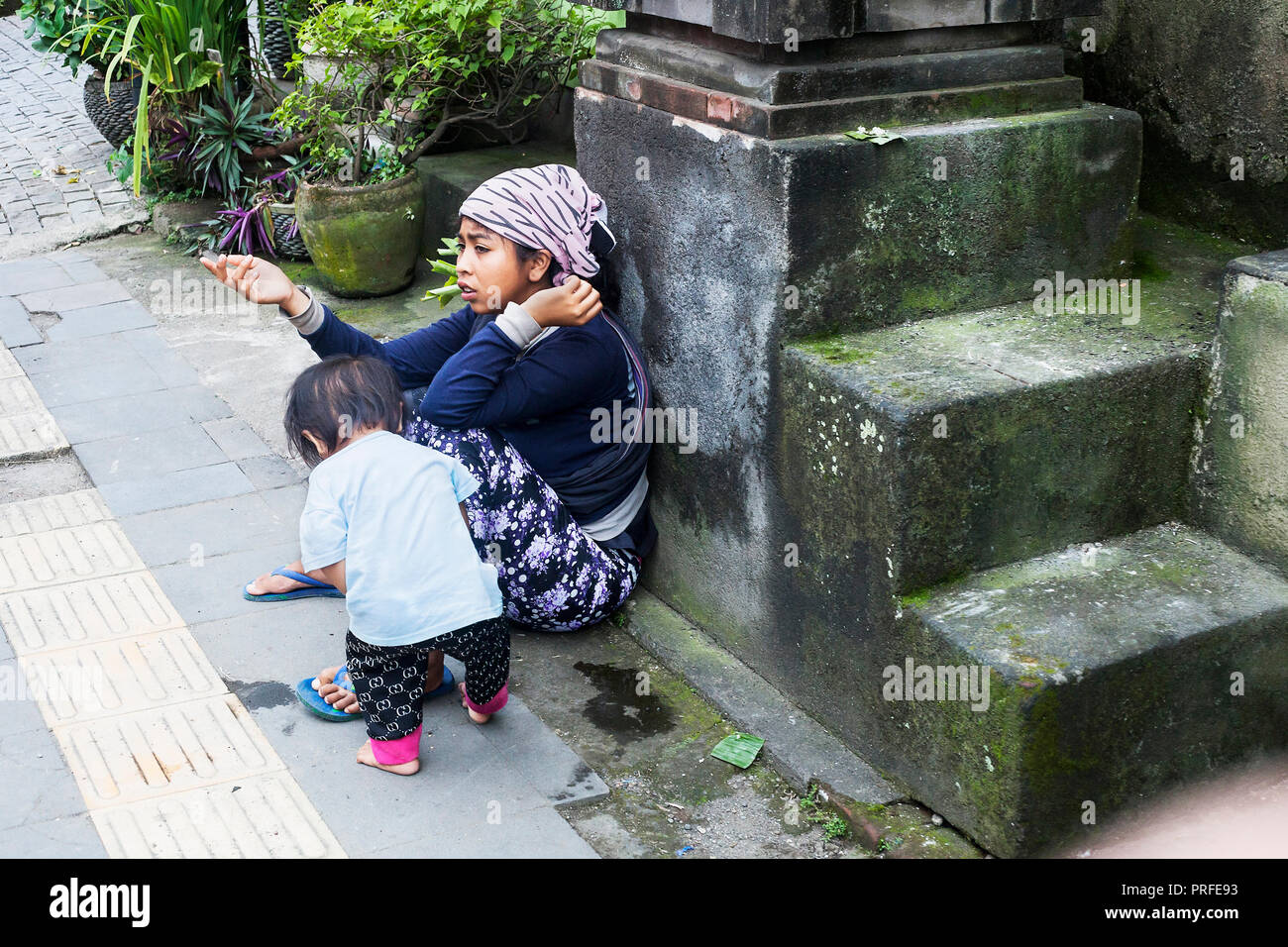 Sitting town begging beggar hi-res stock photography and images - Alamy
