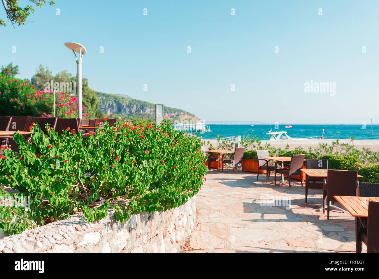 Restaurant tables overlooking mediterranean sea hi-res stock ...