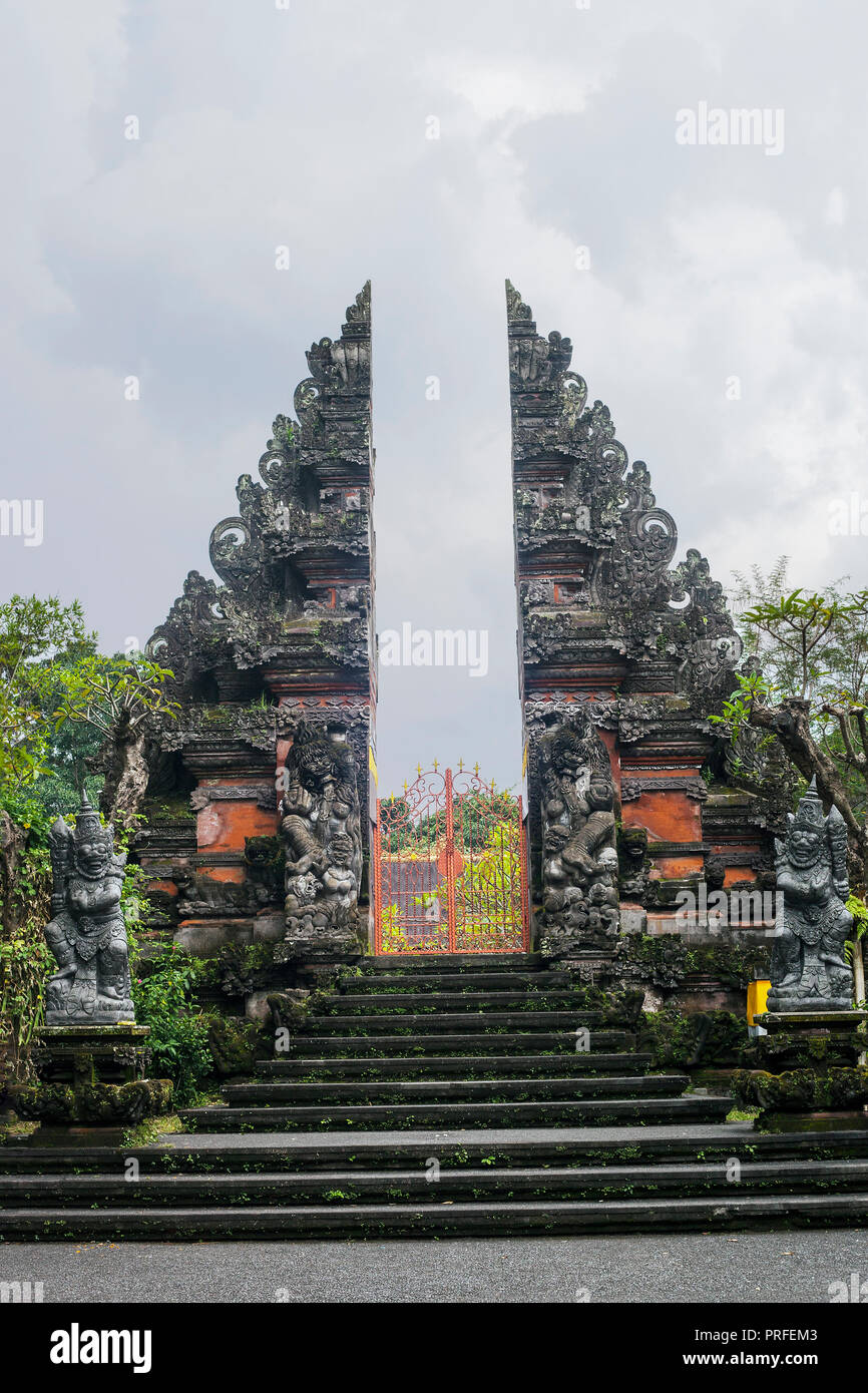 Big stone gate - traditional entrance to Hindu temple with statues on ...