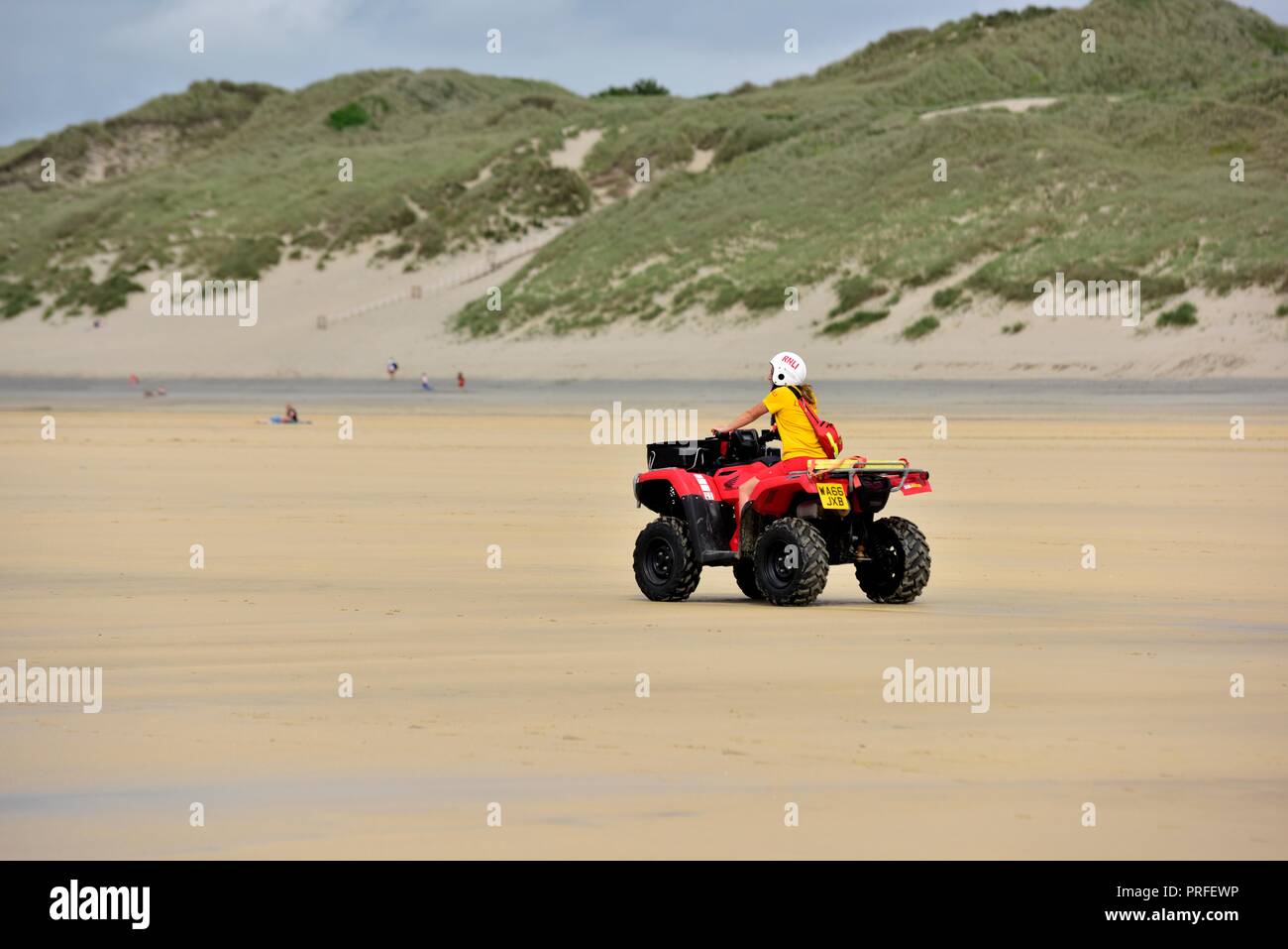 Rnli lifeguard driving an atv quadbike hi-res stock photography and ...