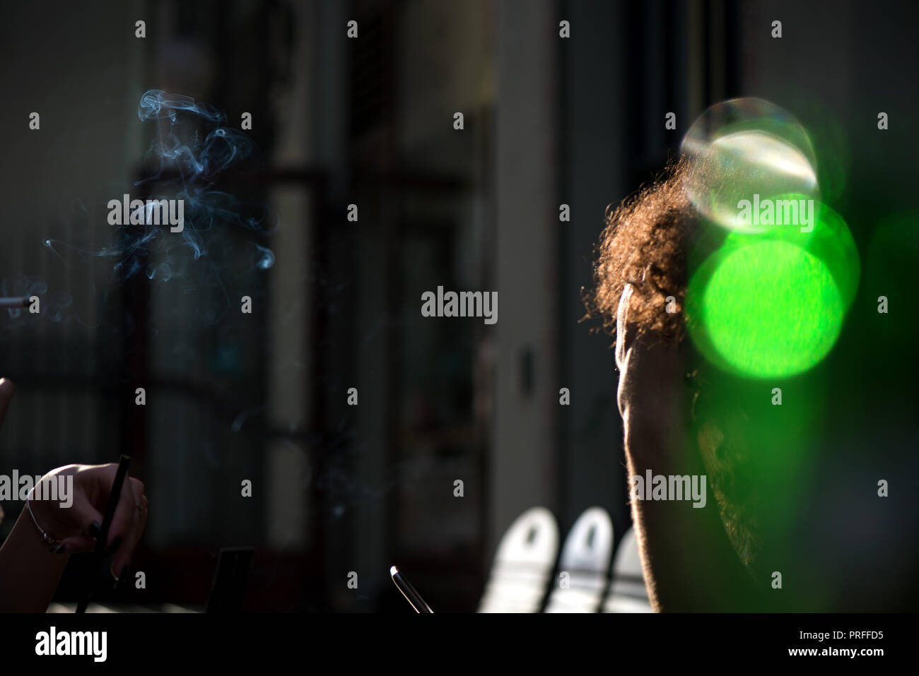 Minors smoking in a public venue, discussing the regulation of tobacco ...