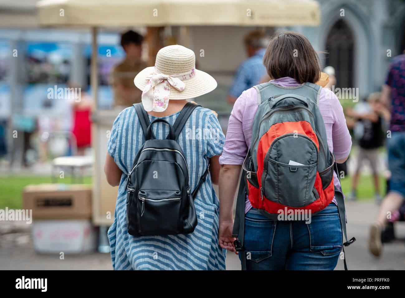 Back view walking woman suitcase hi-res stock photography and images ...