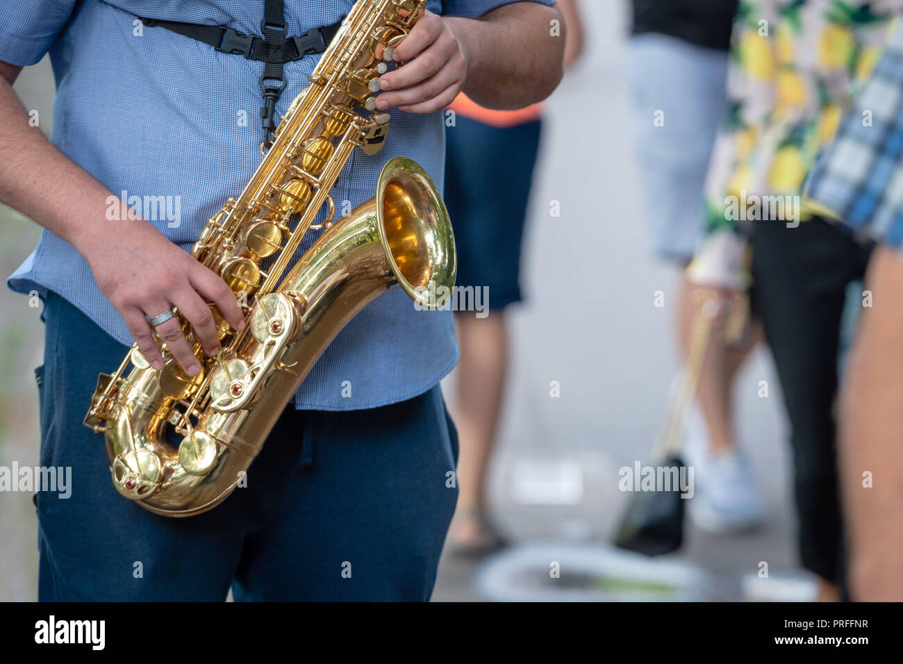 The street musician playing saxophone Stock Photo - Alamy