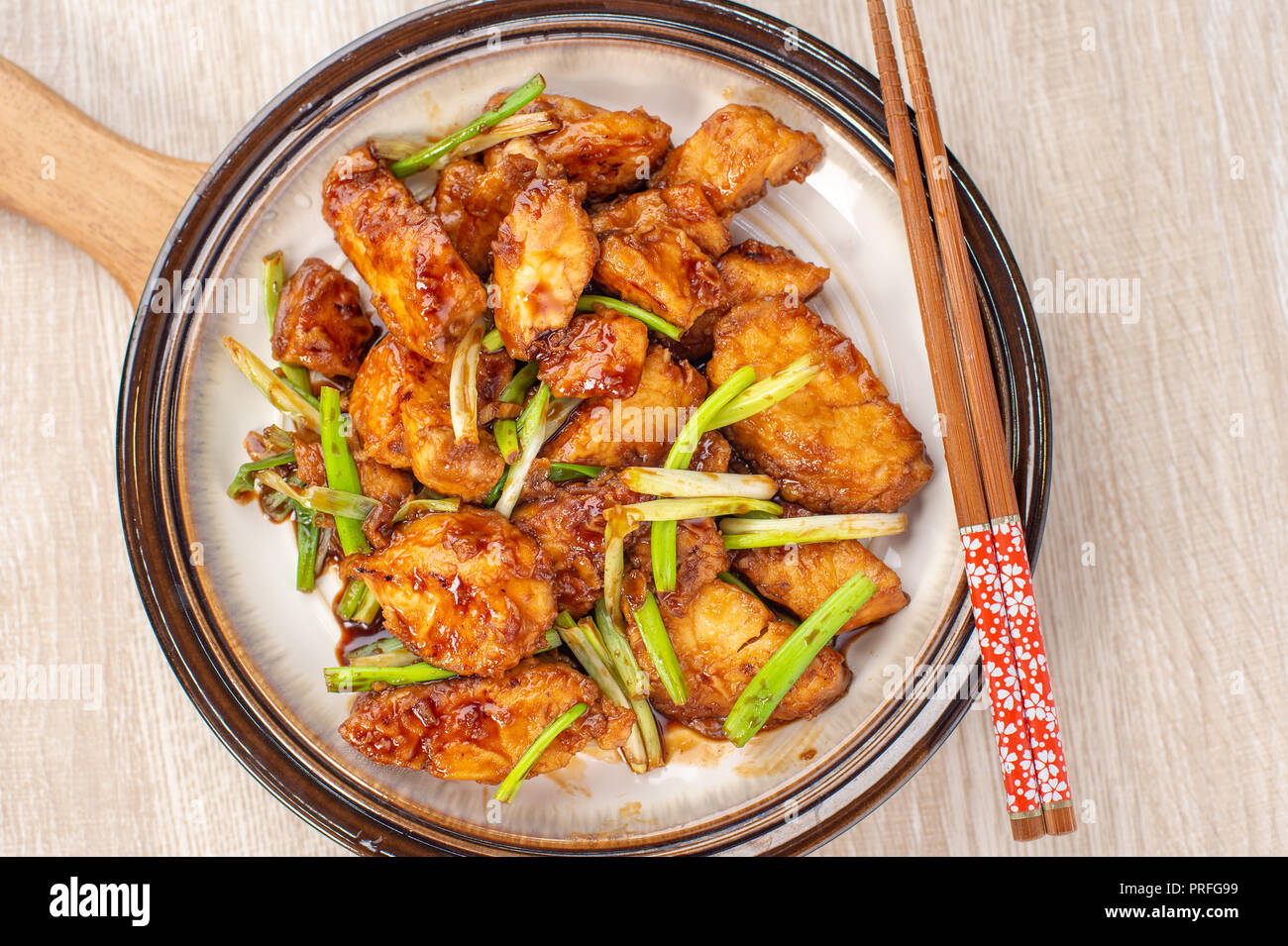 Delicious homemade stewed fish slices with scallion in wooden ...