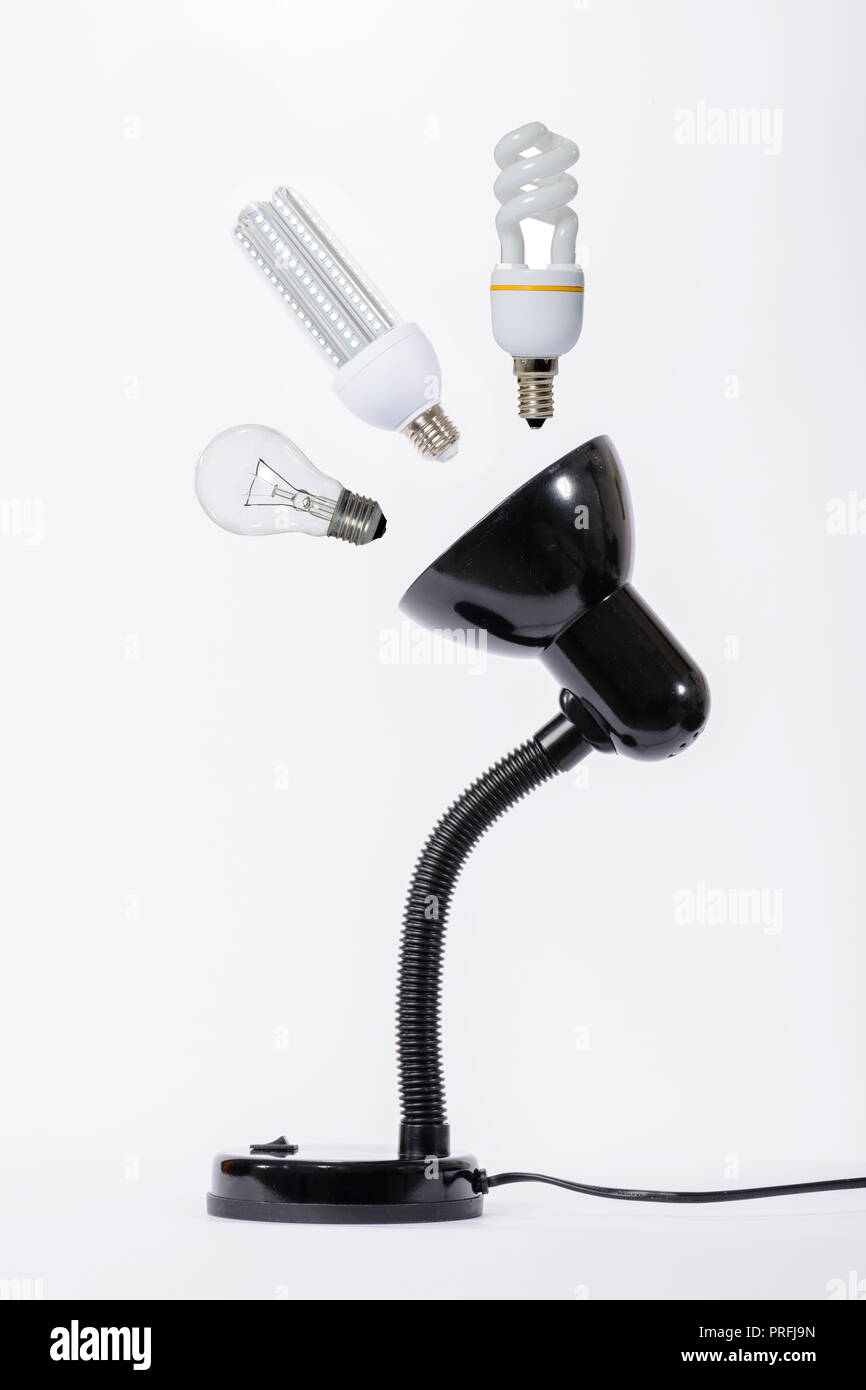 LED lamp replaces the old standard. White background Stock Photo - Alamy