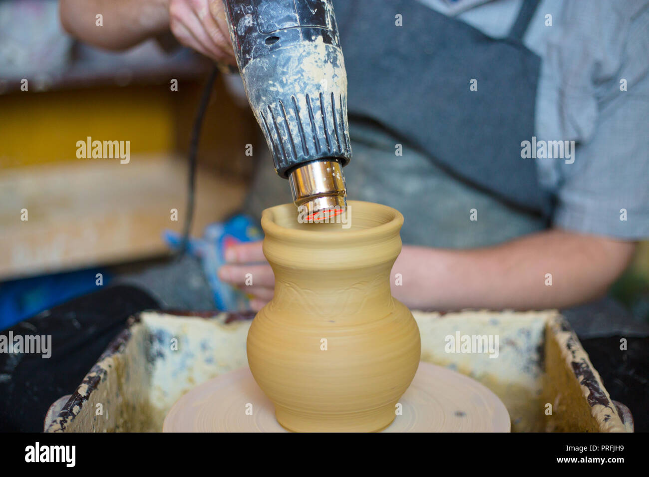 Professional male potter drying hi-res stock photography and images - Alamy