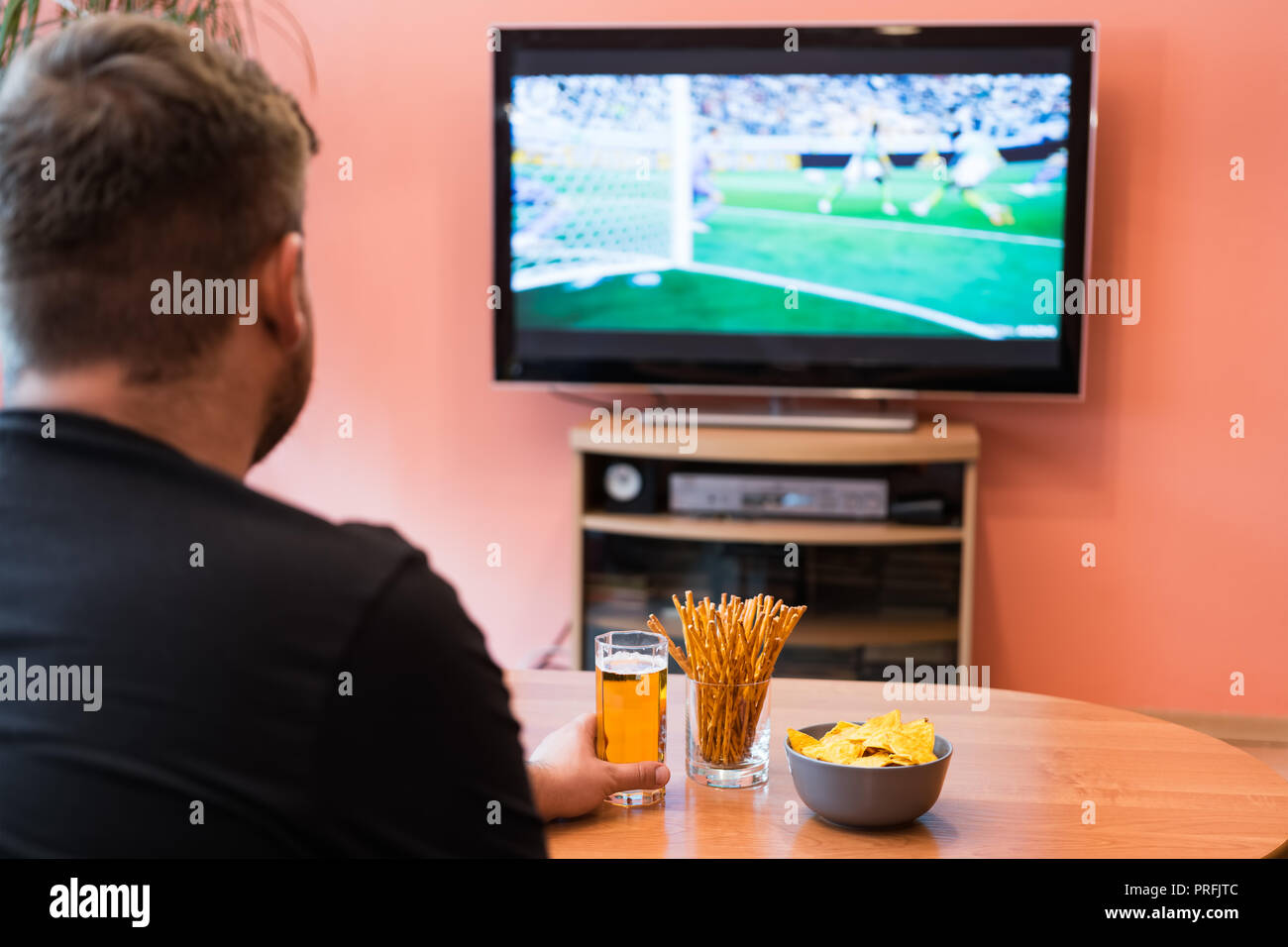 Football fan on sofa stadium hi-res stock photography and images - Alamy
