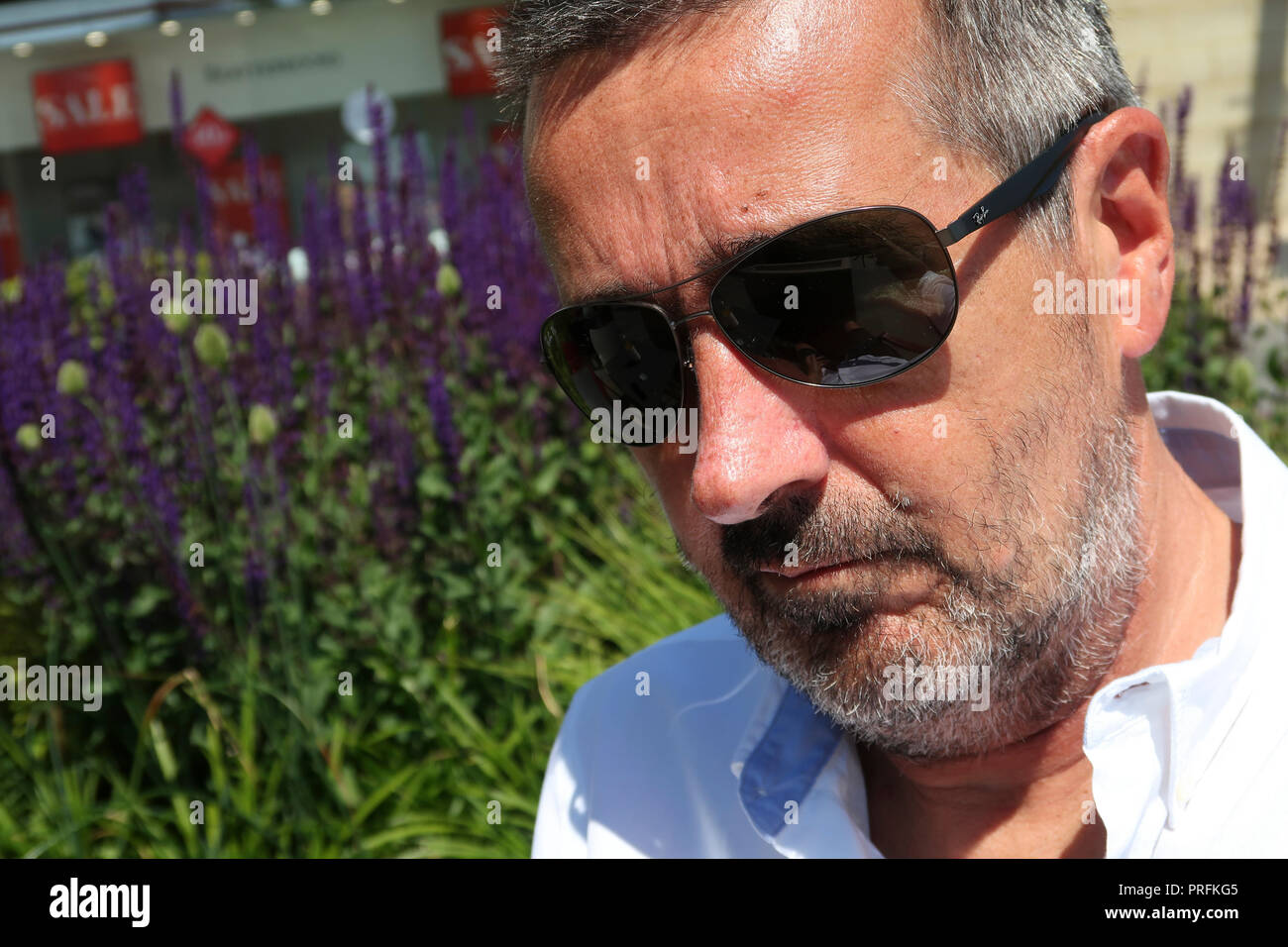 Headshot portrait of tanned middle aged man Stock Photo - Alamy