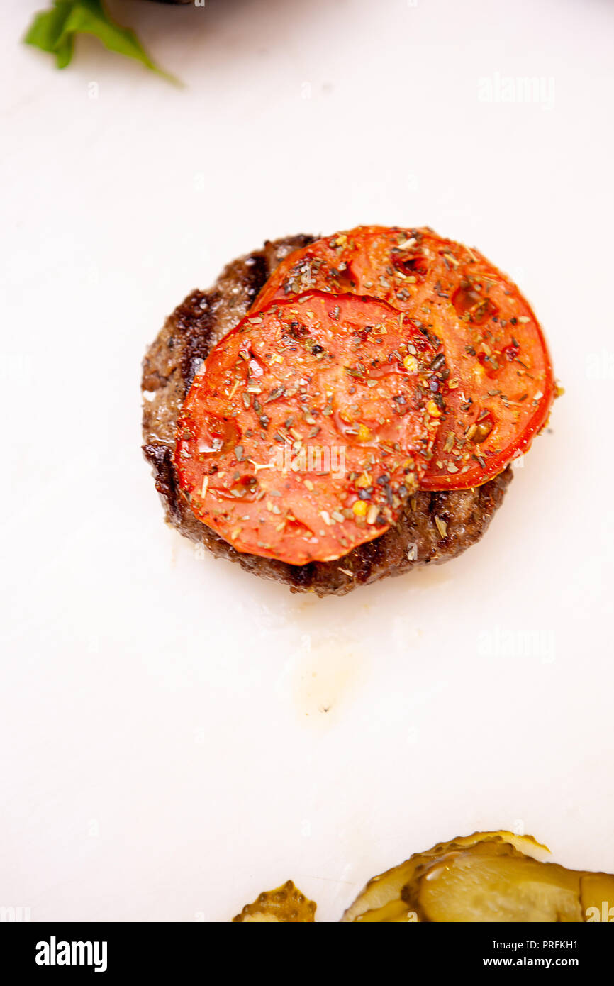 Burger making process hi-res stock photography and images - Alamy