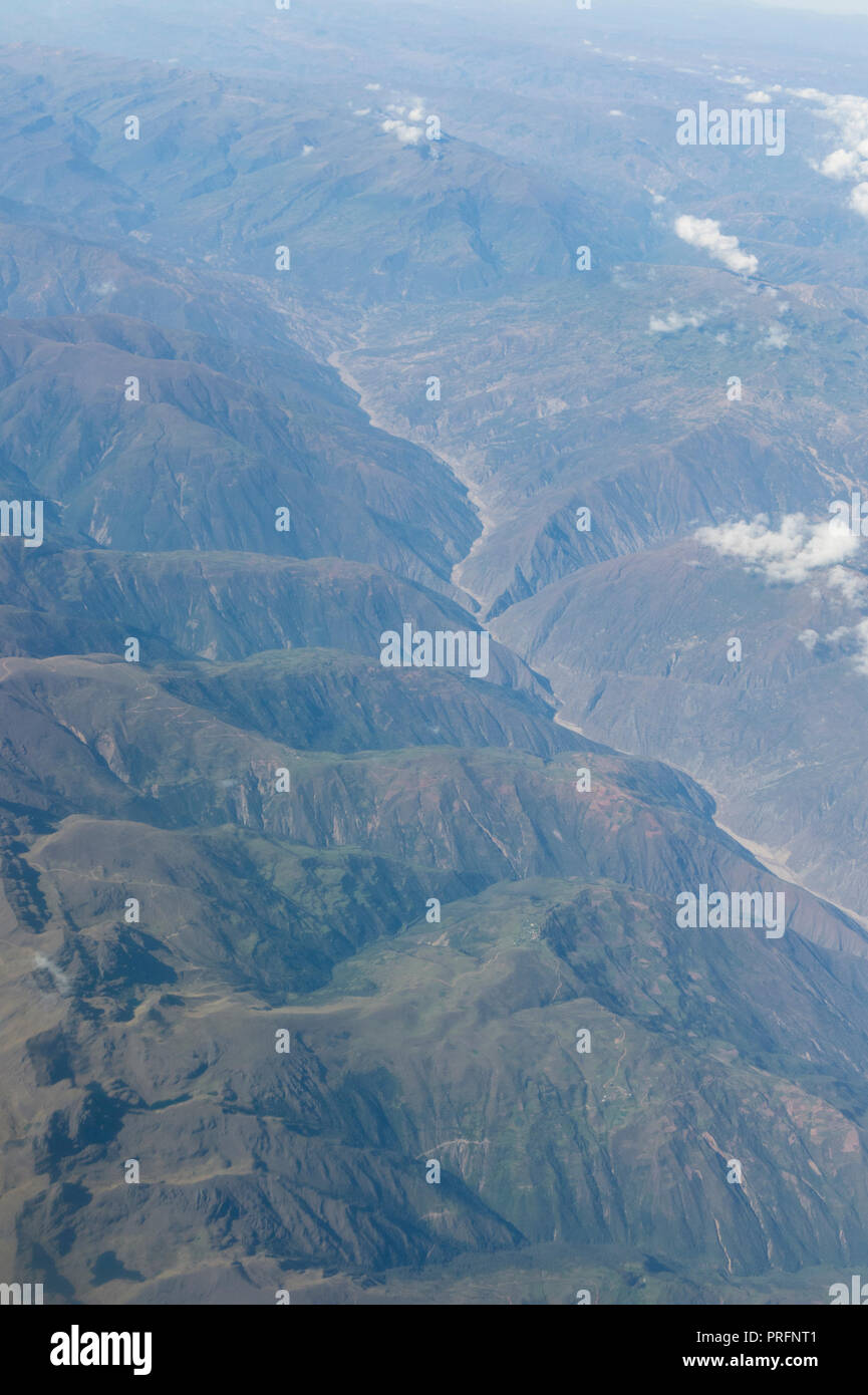 Aerial view of dry desert and the Andes Mountains somewhere over South ...