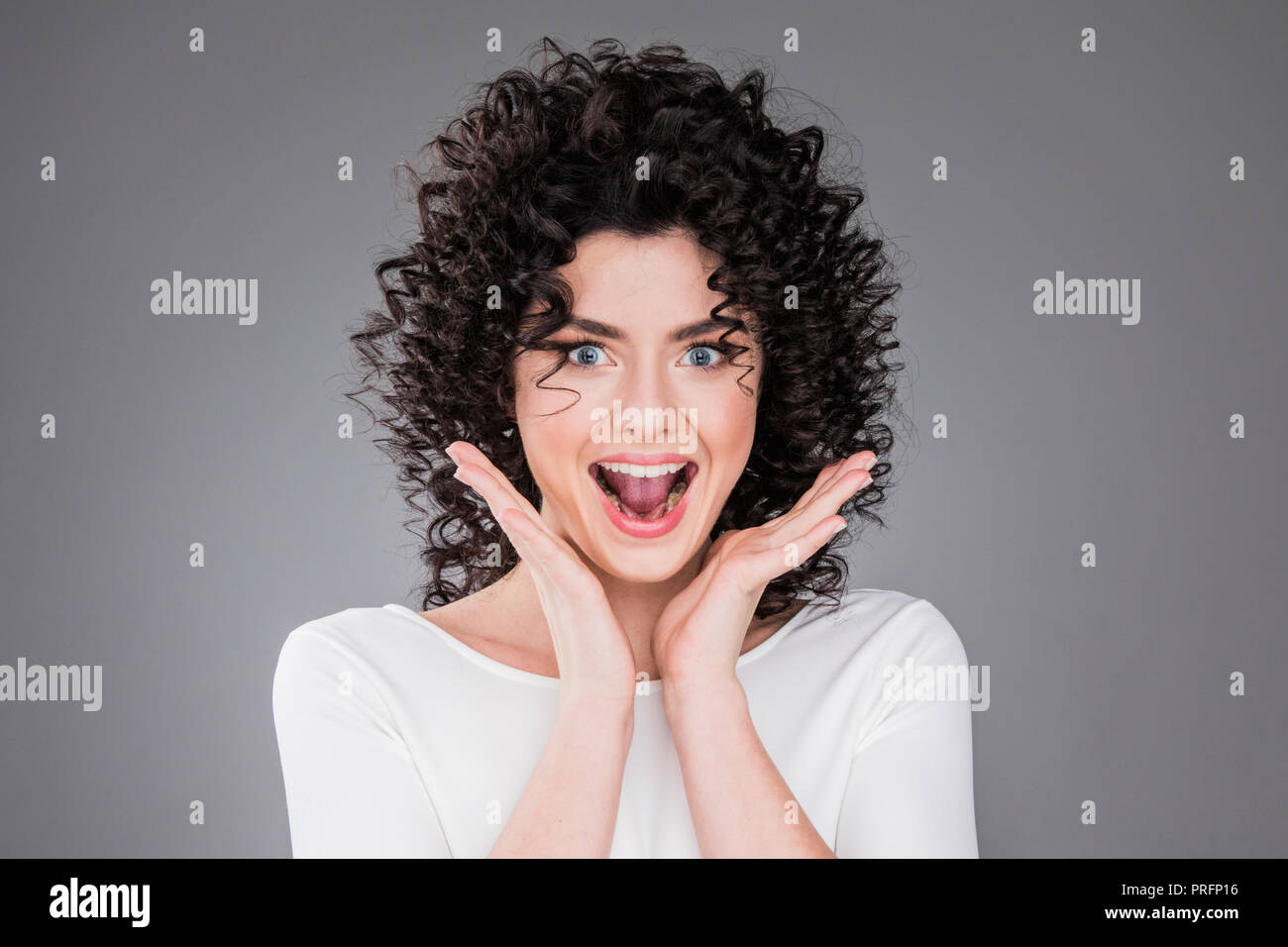 Surprised excited beautiful woman screaming amazed in joy Stock Photo ...
