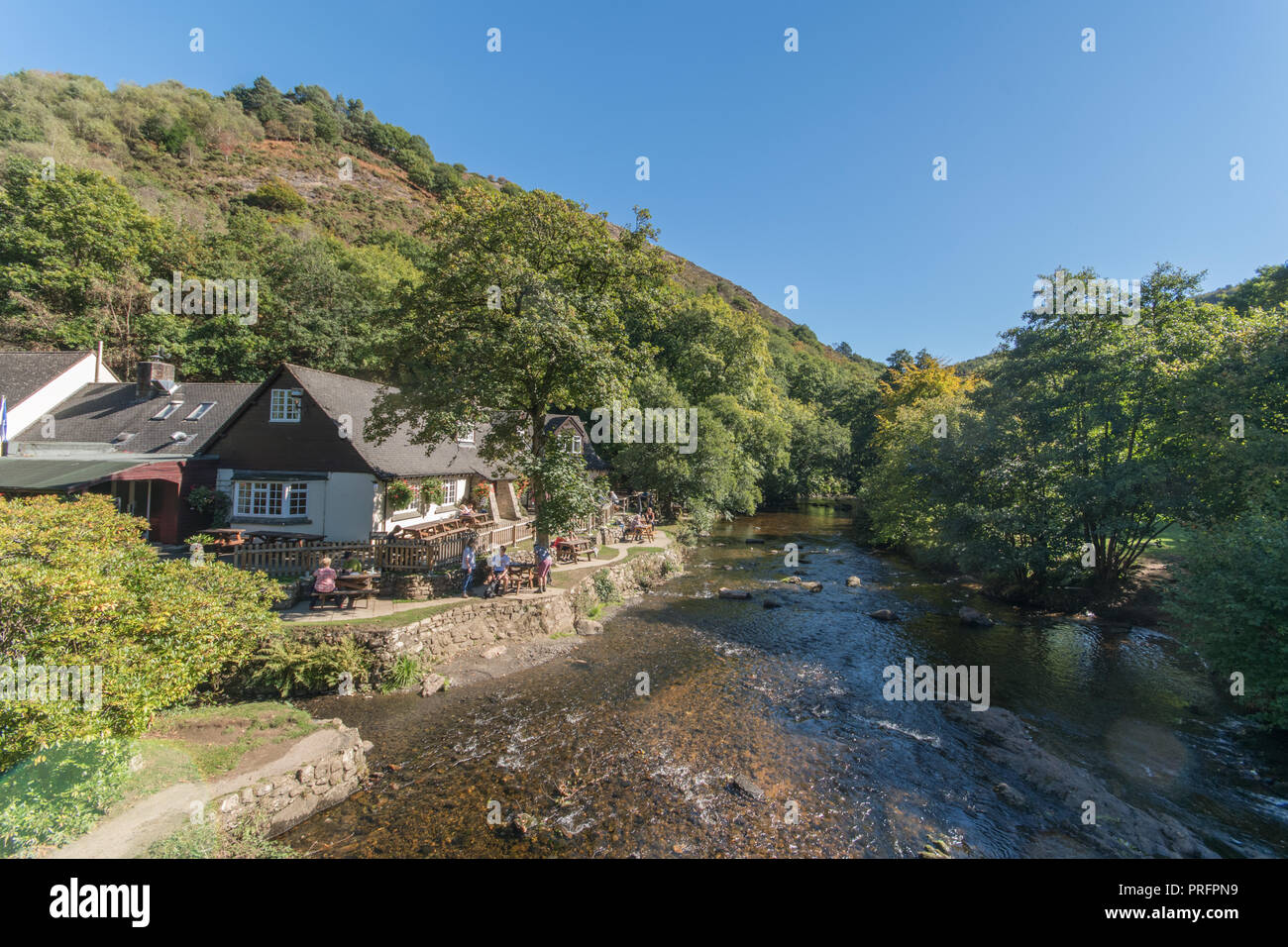 Fingle Bridge Inn next to the river Teign in Dartmoor with people ...