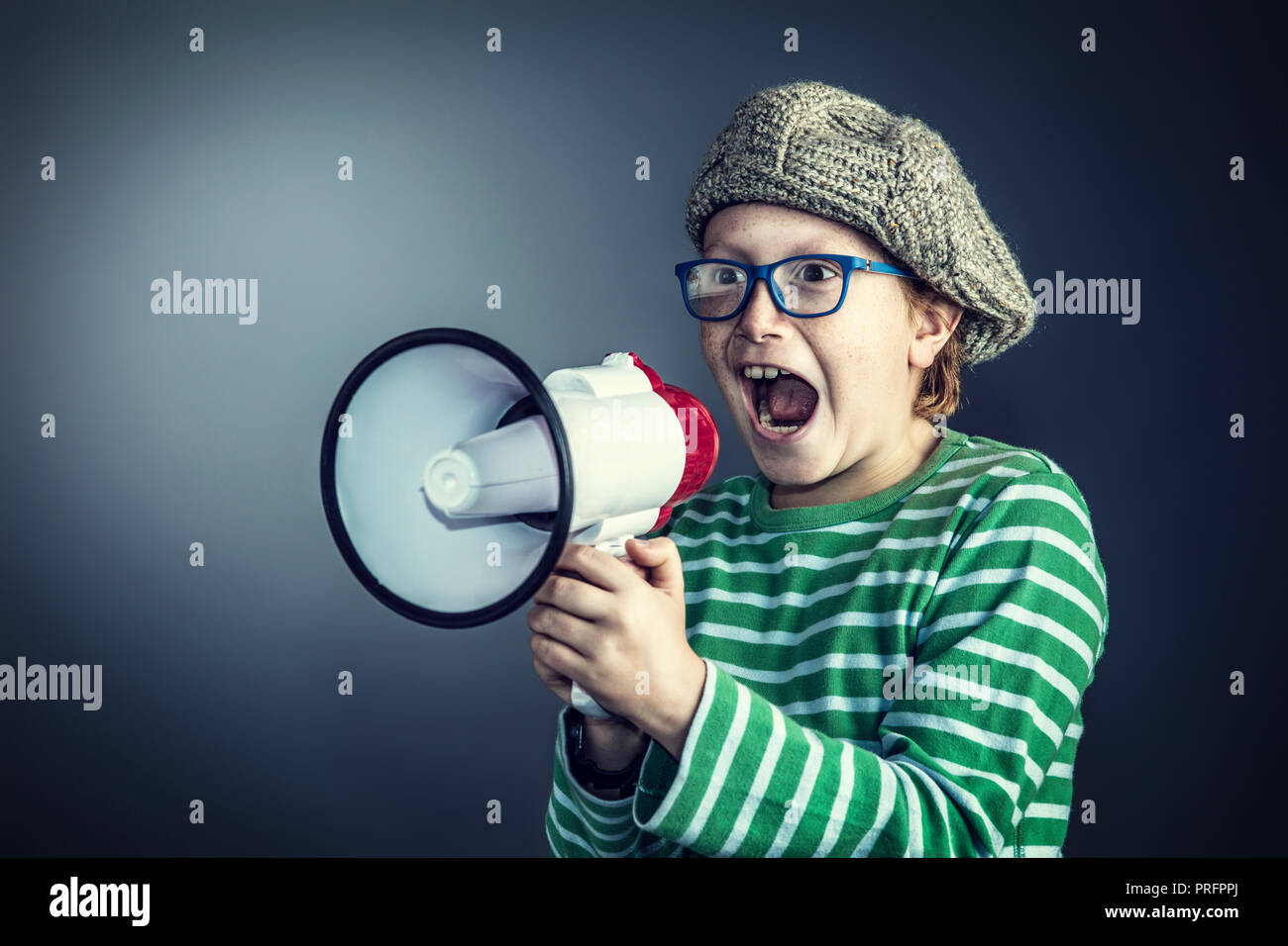 young boy with megaphone studio portrait Stock Photo - Alamy