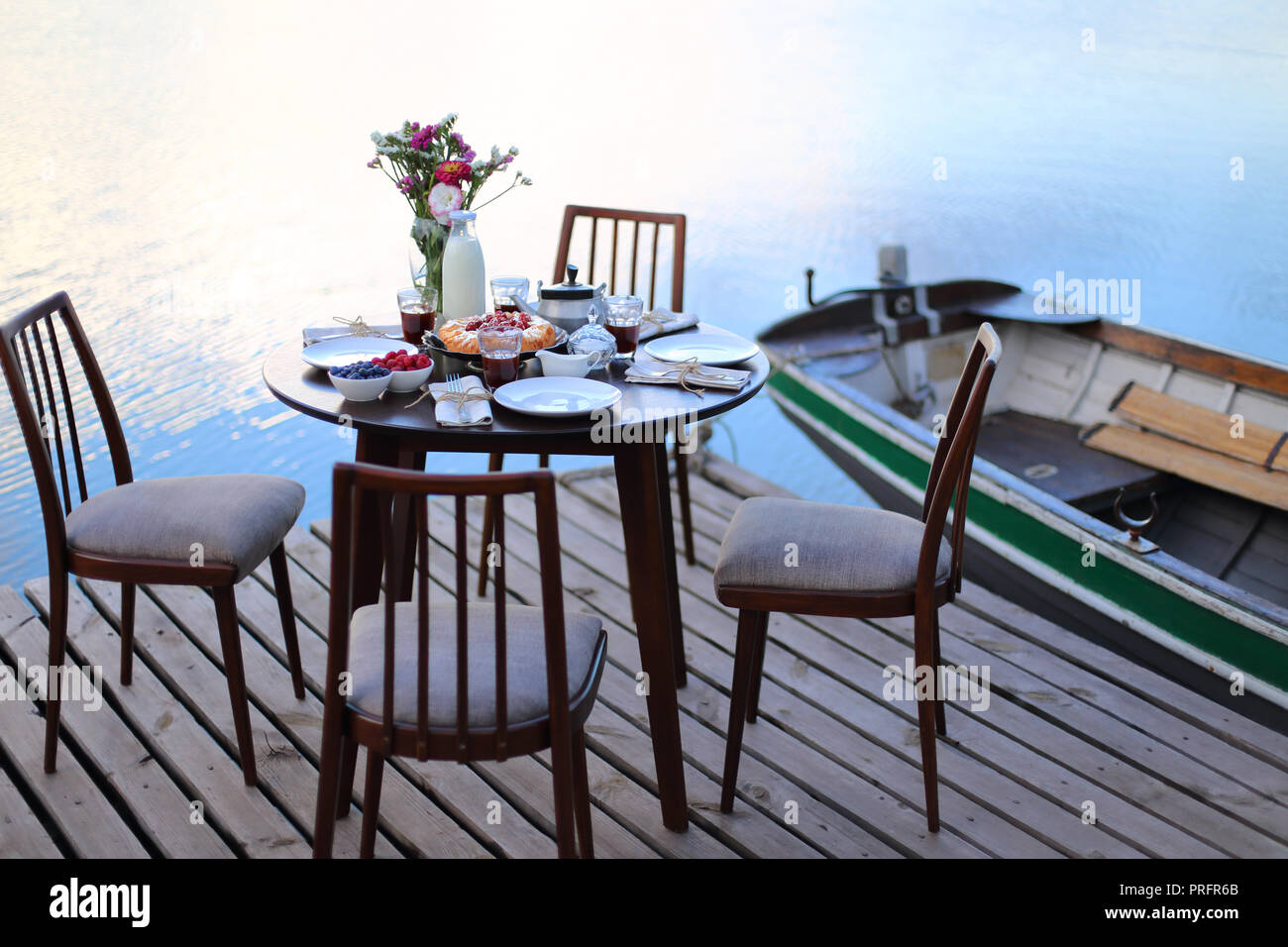 Table served for party dinner on river pier. Food, meal, banquet ...